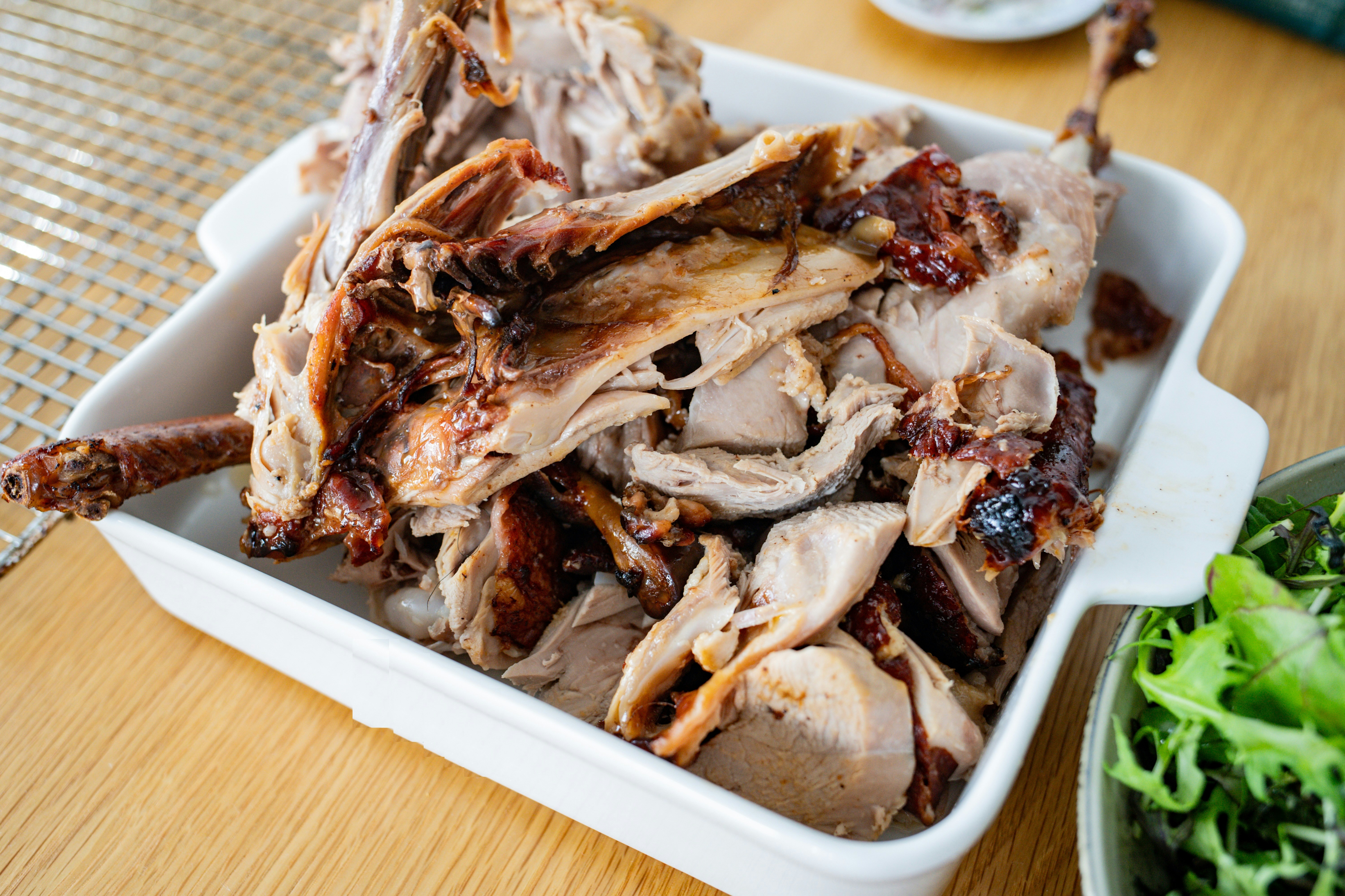 Tender Roast Reposed in White Tray, Carving Moment Revealed