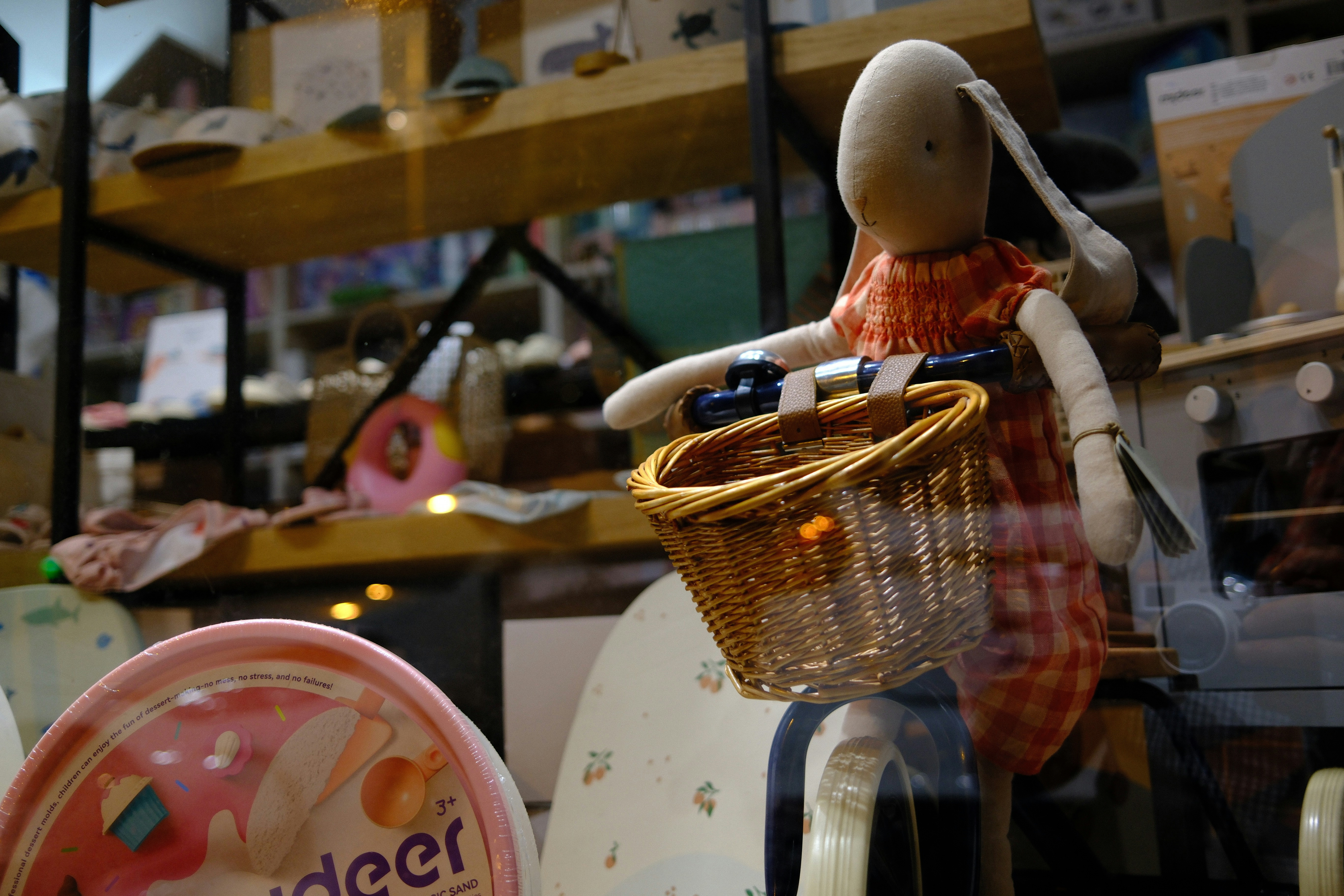 Wicker Basket and Plush Doll in a Shop Window