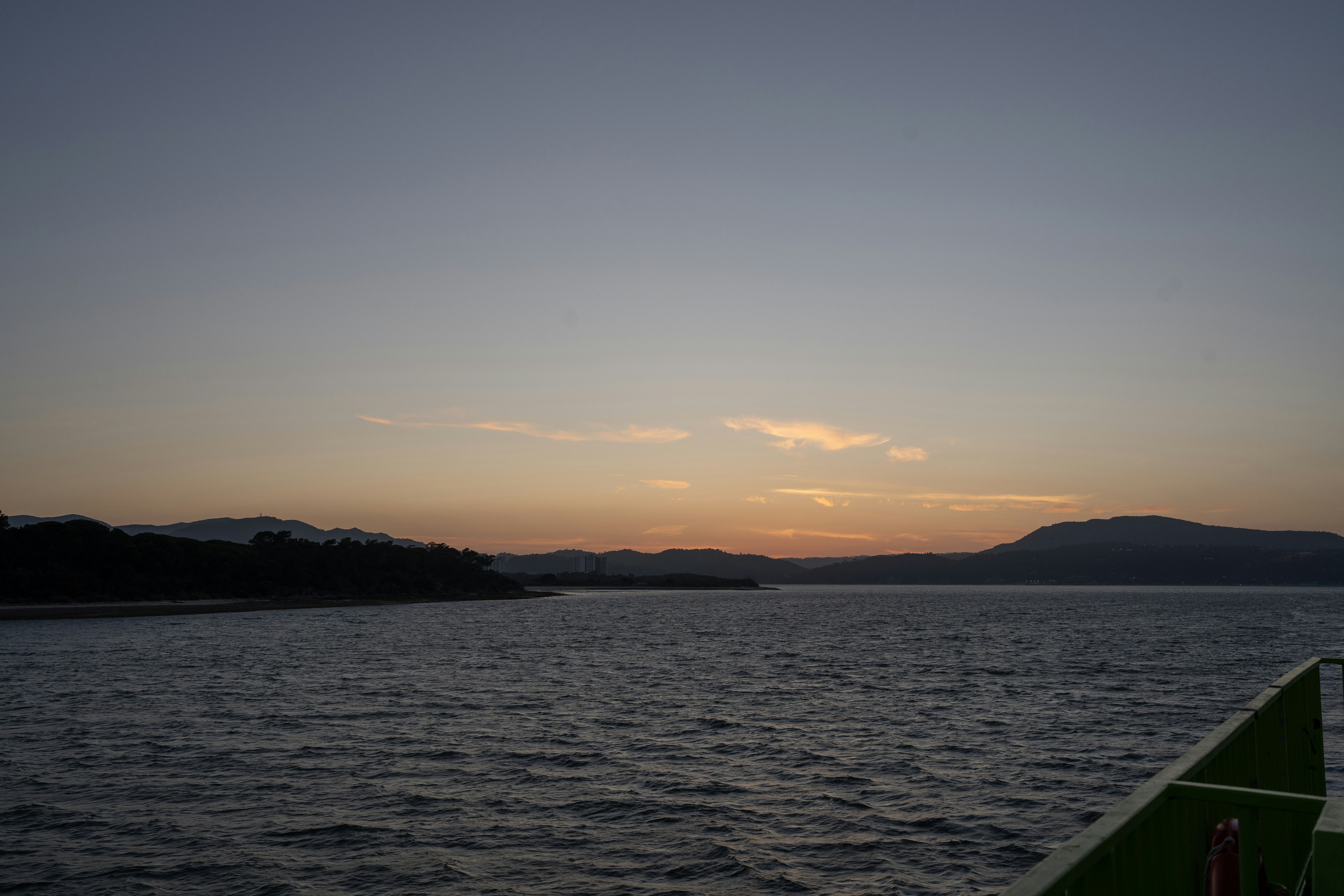 Sunset Silence Over a Distant Horizon from a Ship Deck