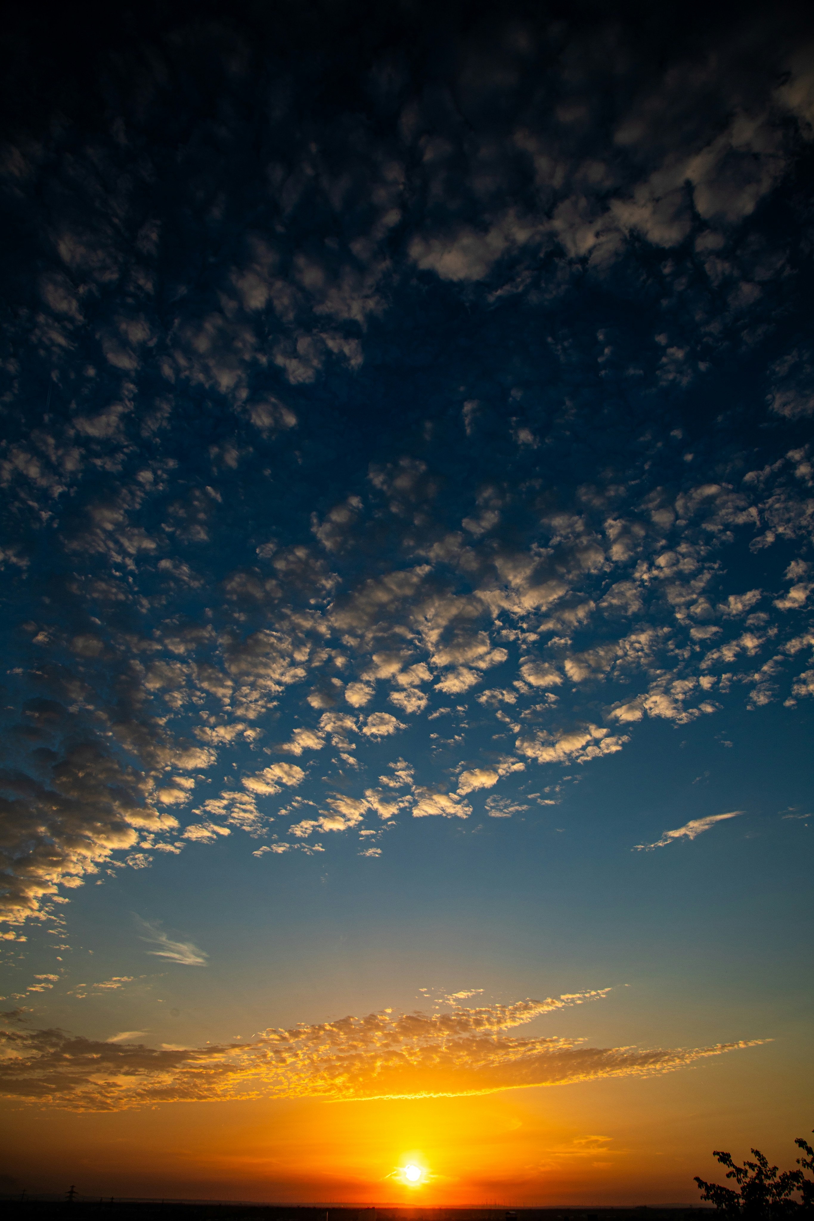 Golden Horizon: Sun Droplets Over a Quiet Coastal Plain at Dusk