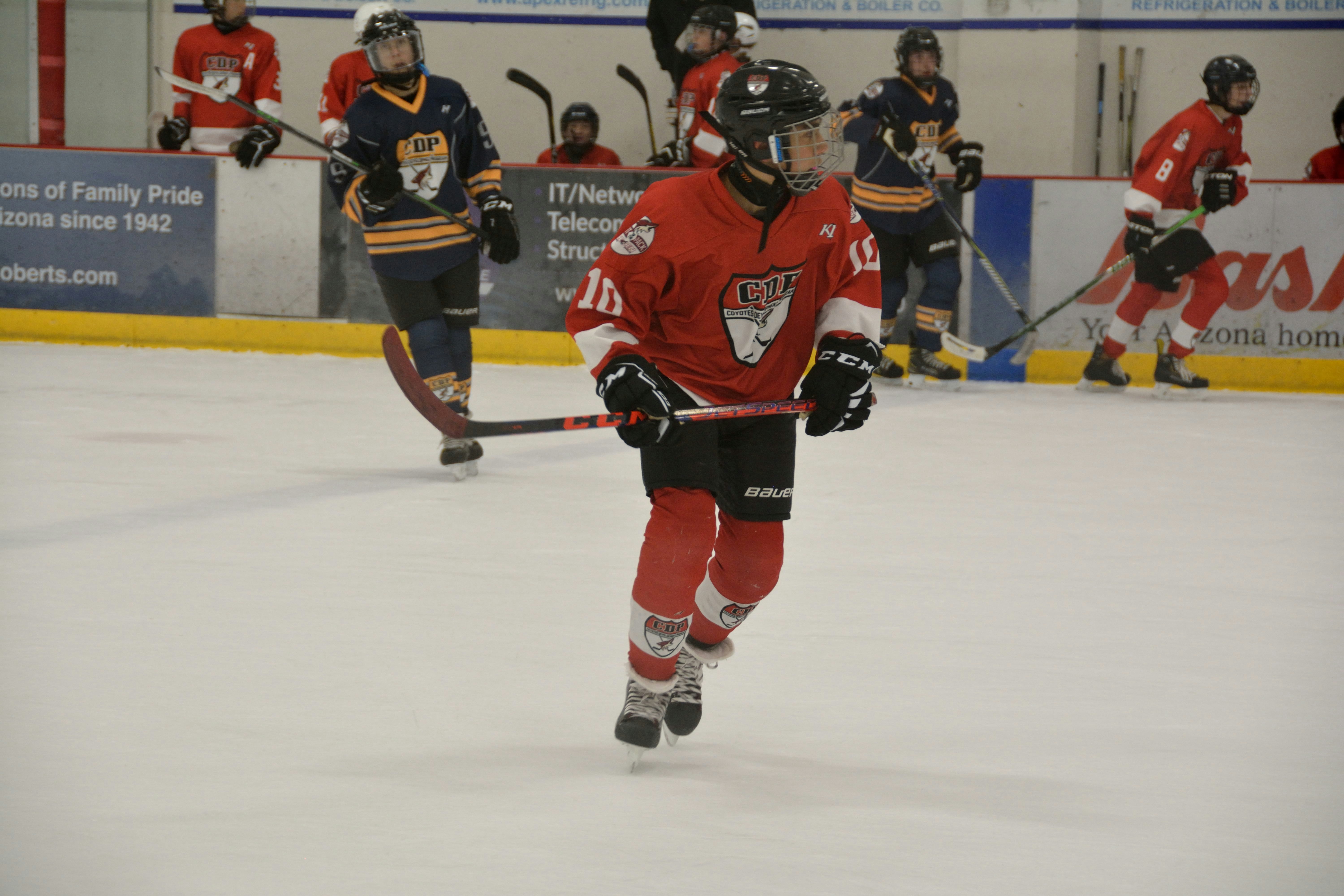 Center Ice Sprint: Red-jersey Skater Leads the Charge