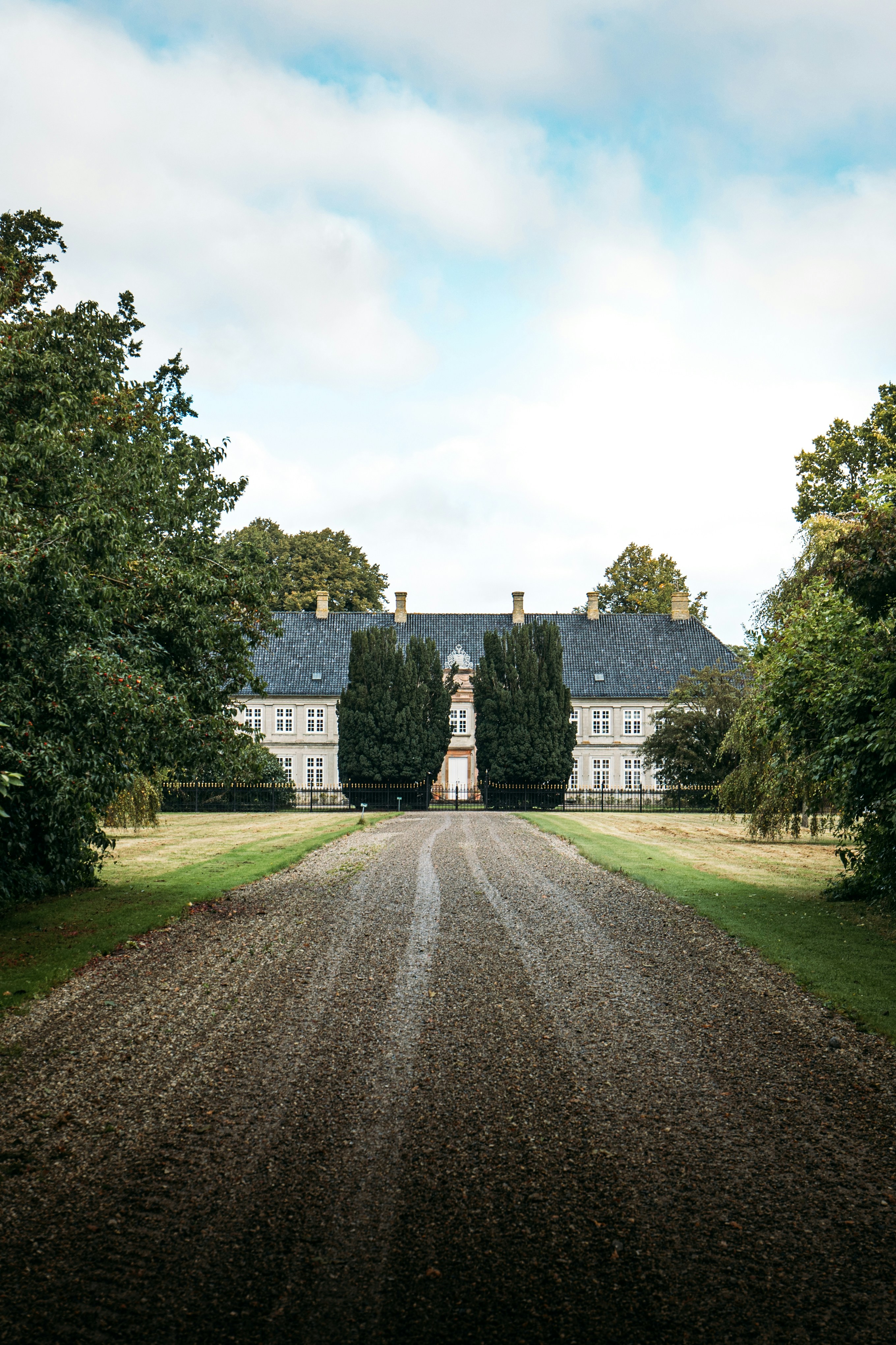 A Long Drive to a Courtyard Chateau