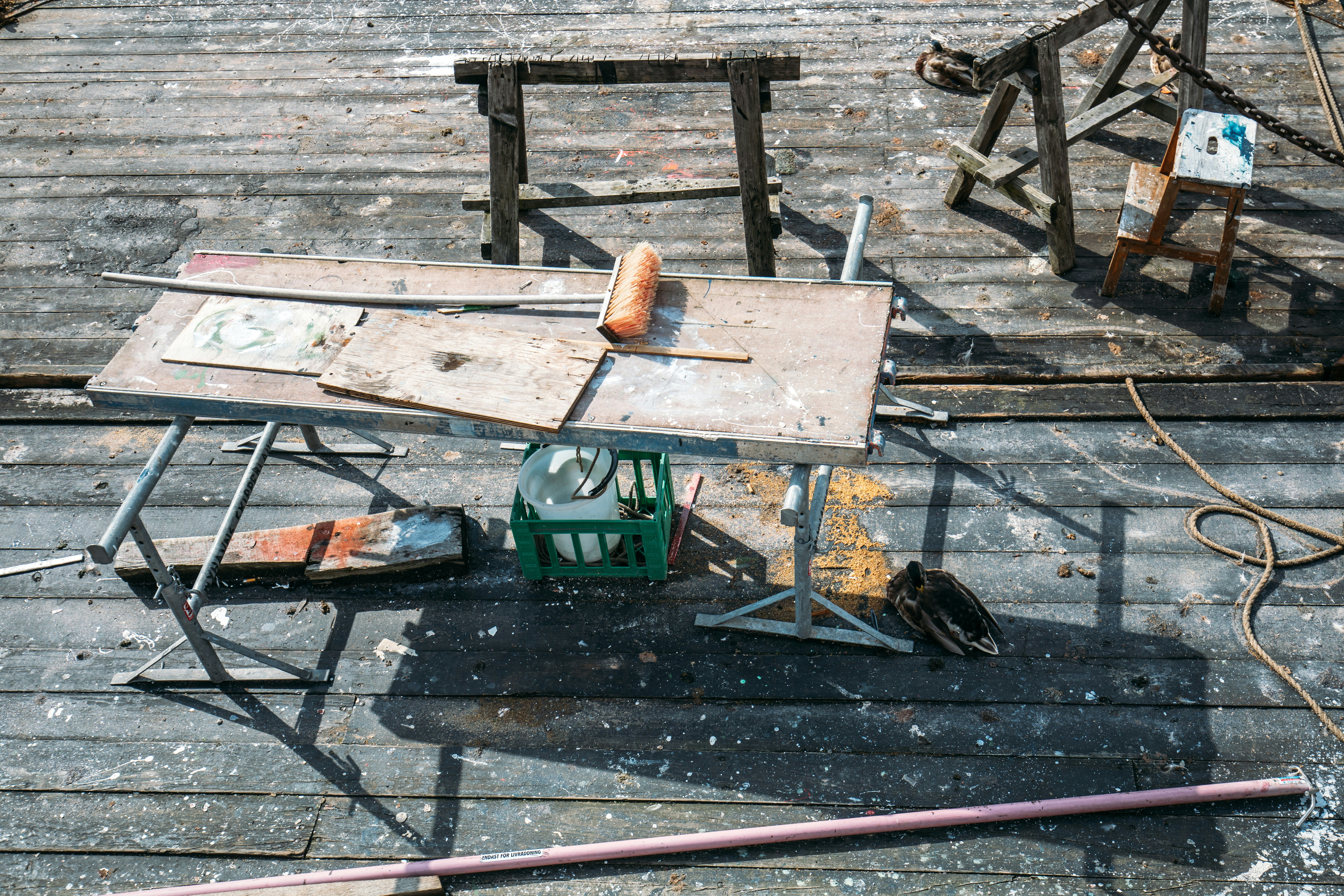 Sun-bleached Workbench: A Quiet Mess of Tools and Wood