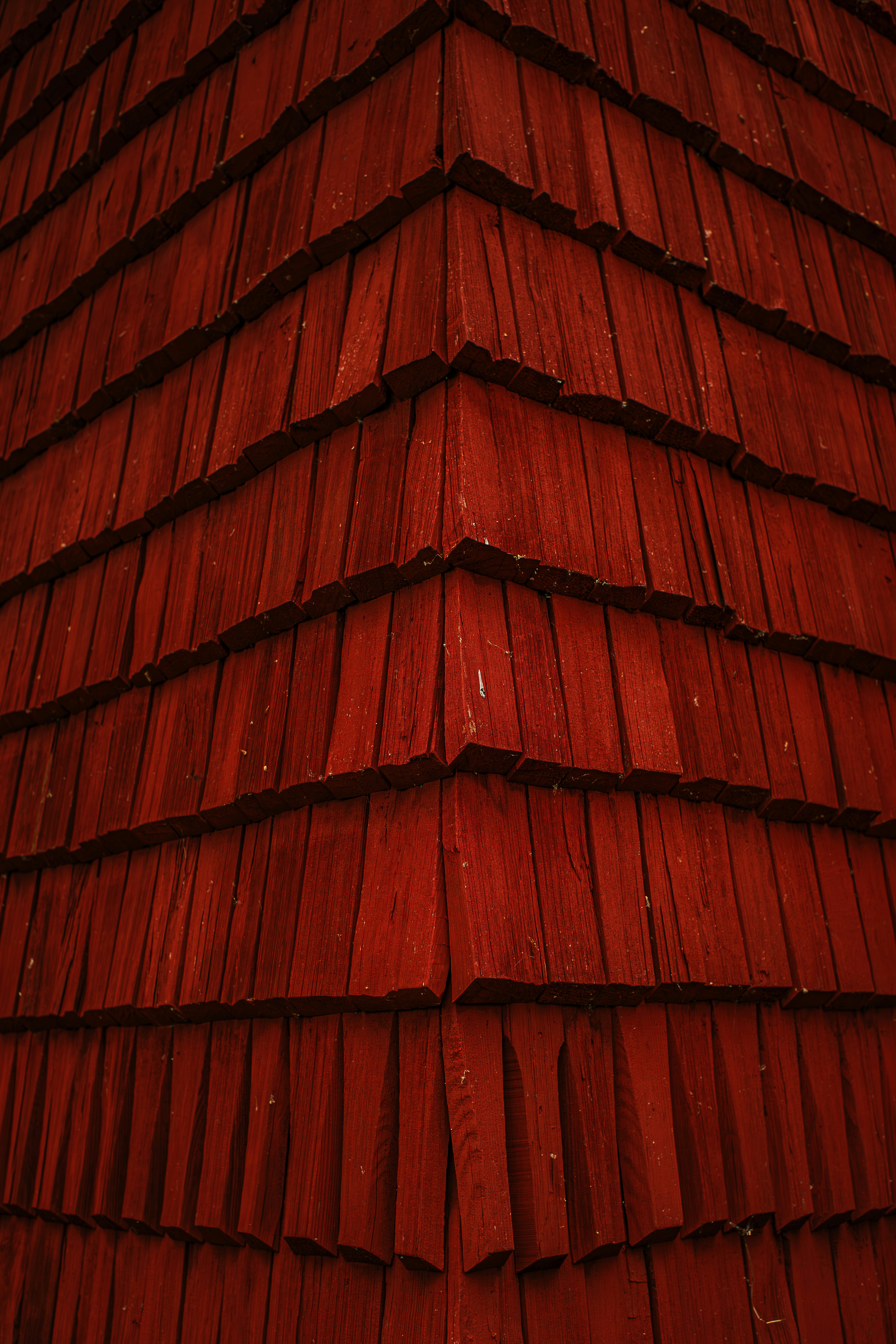 Crimson Chevron: A Close Knit Pyramid of Red Wooden Slats
