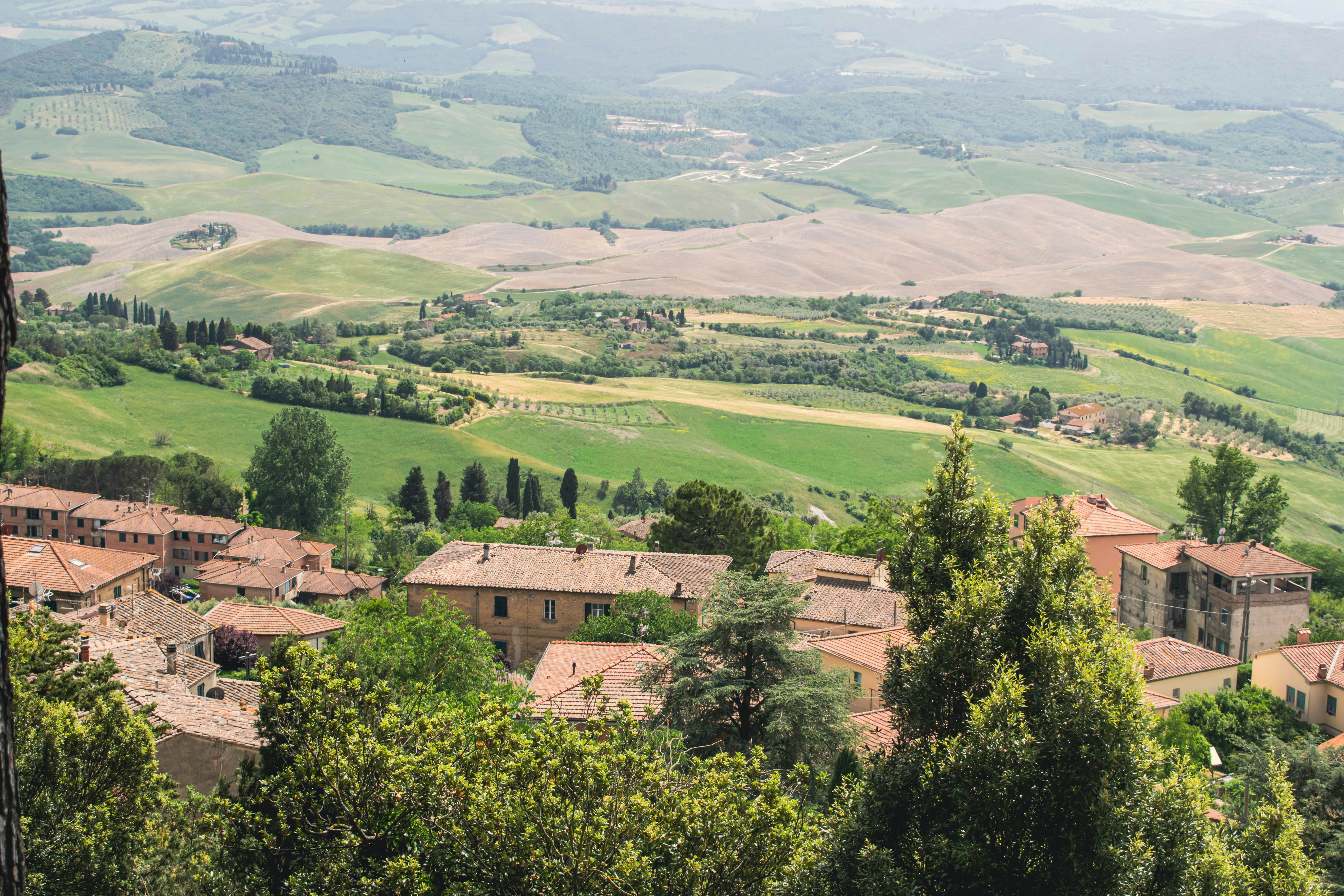 Hilltop Village Emerges from a Patchwork of Tuscan-like Fields