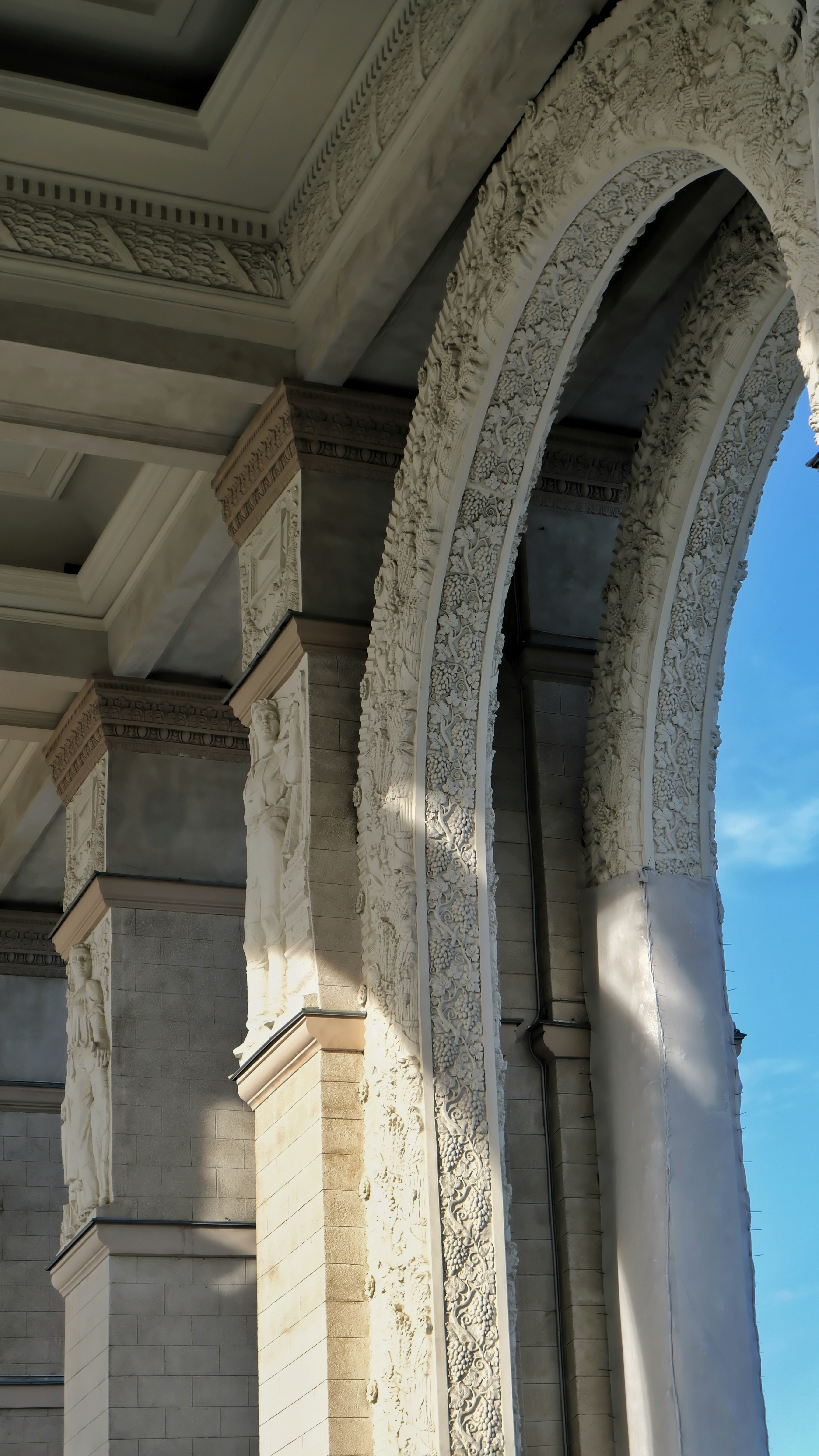 Archway Detail: Carved Stone Frieze Toward a Sunlit Sky