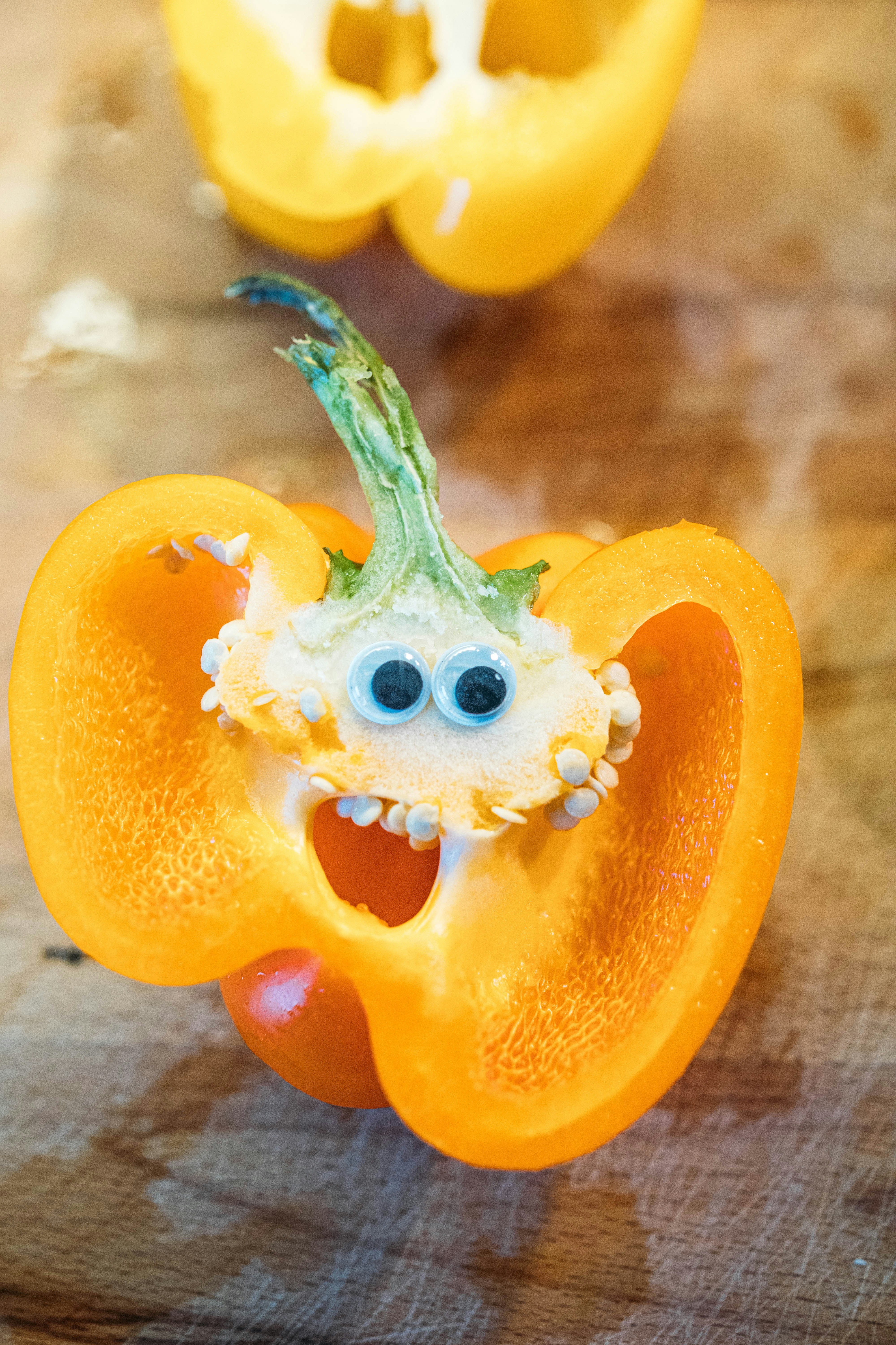 Whimsical Pepper Portrait with googly-eyed Gourd