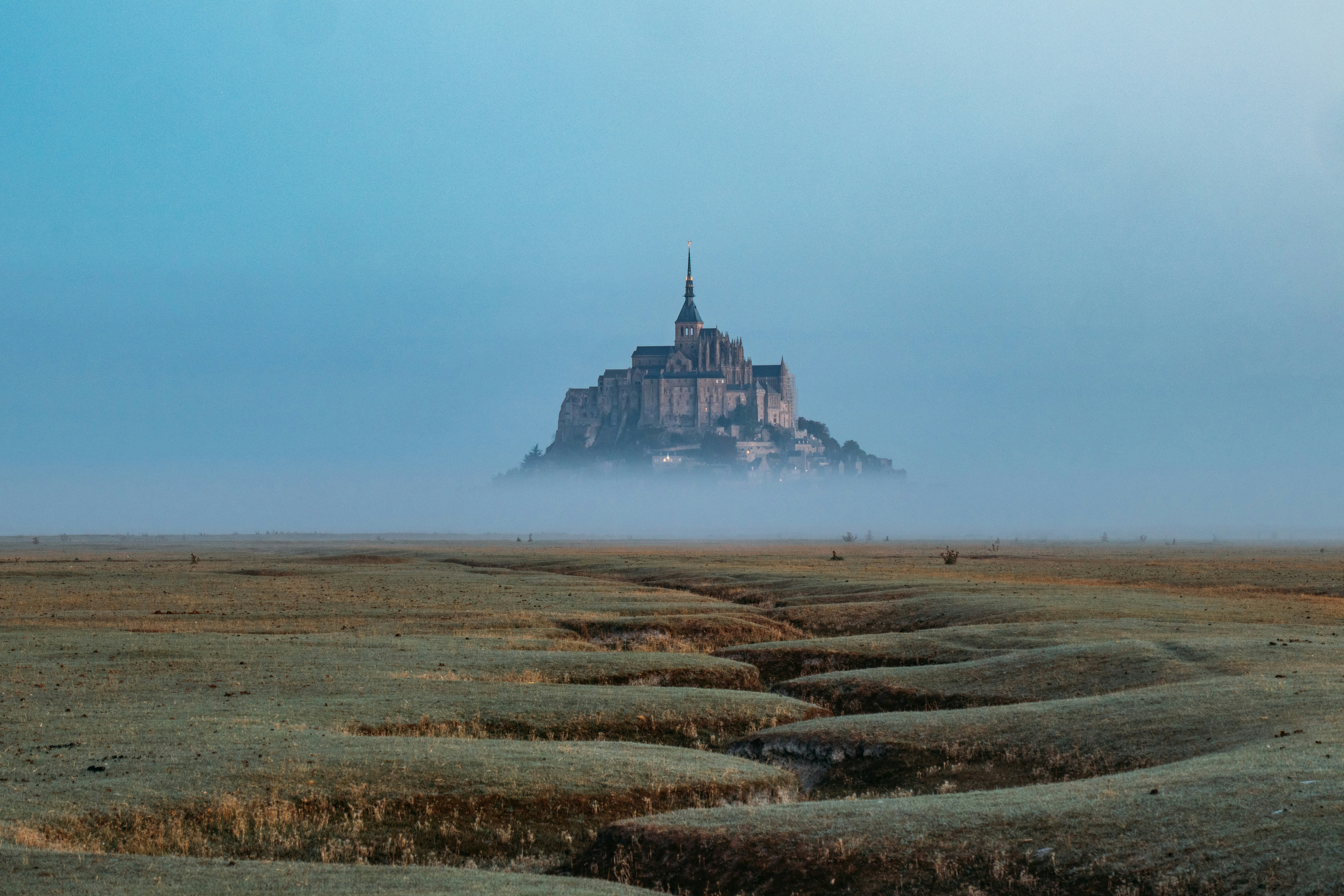 Mist-Wedged Abbey: A solitary fortress rising from the marsh