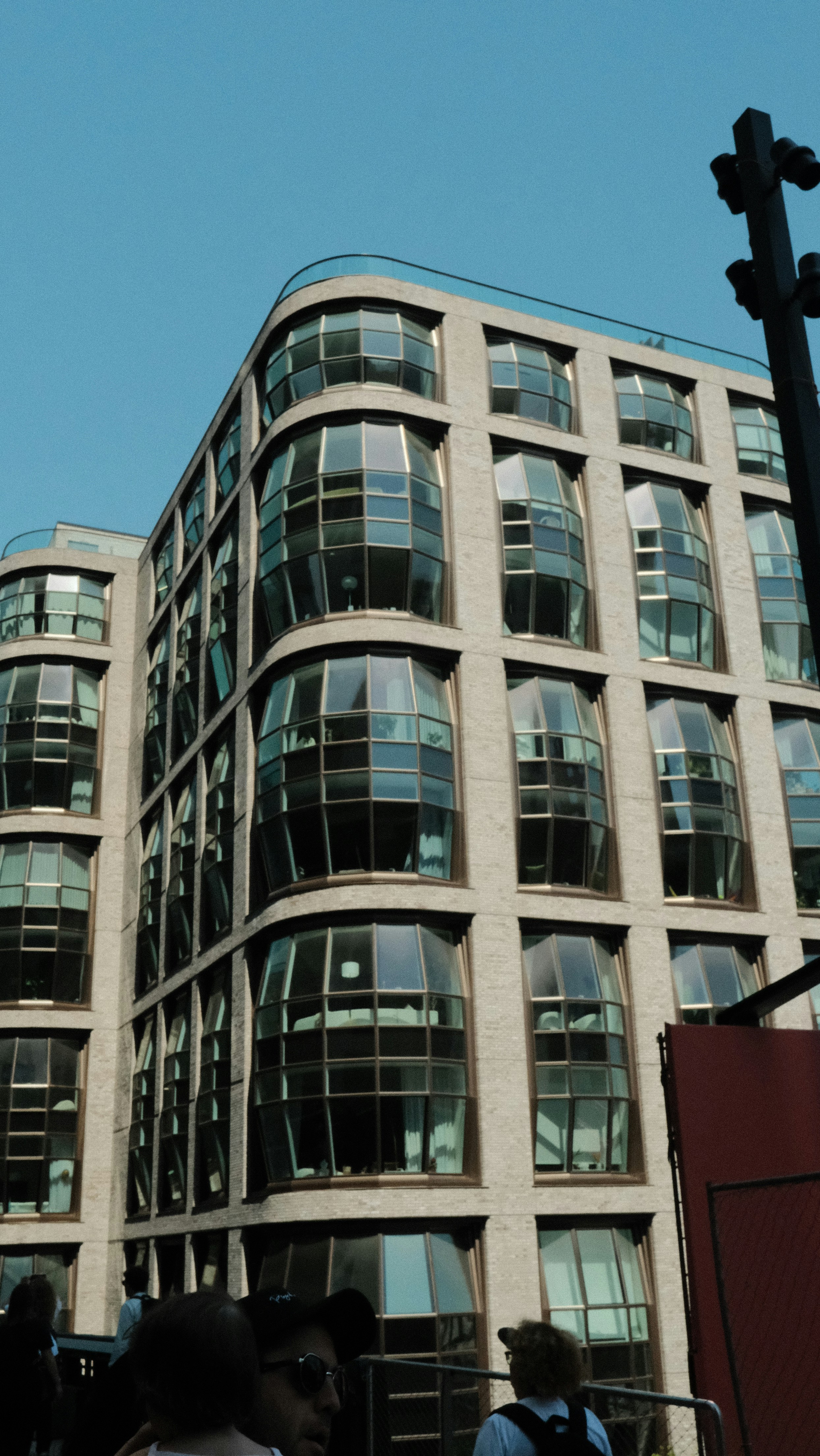 Cornered Glass: A City Building Leaning into the Sky