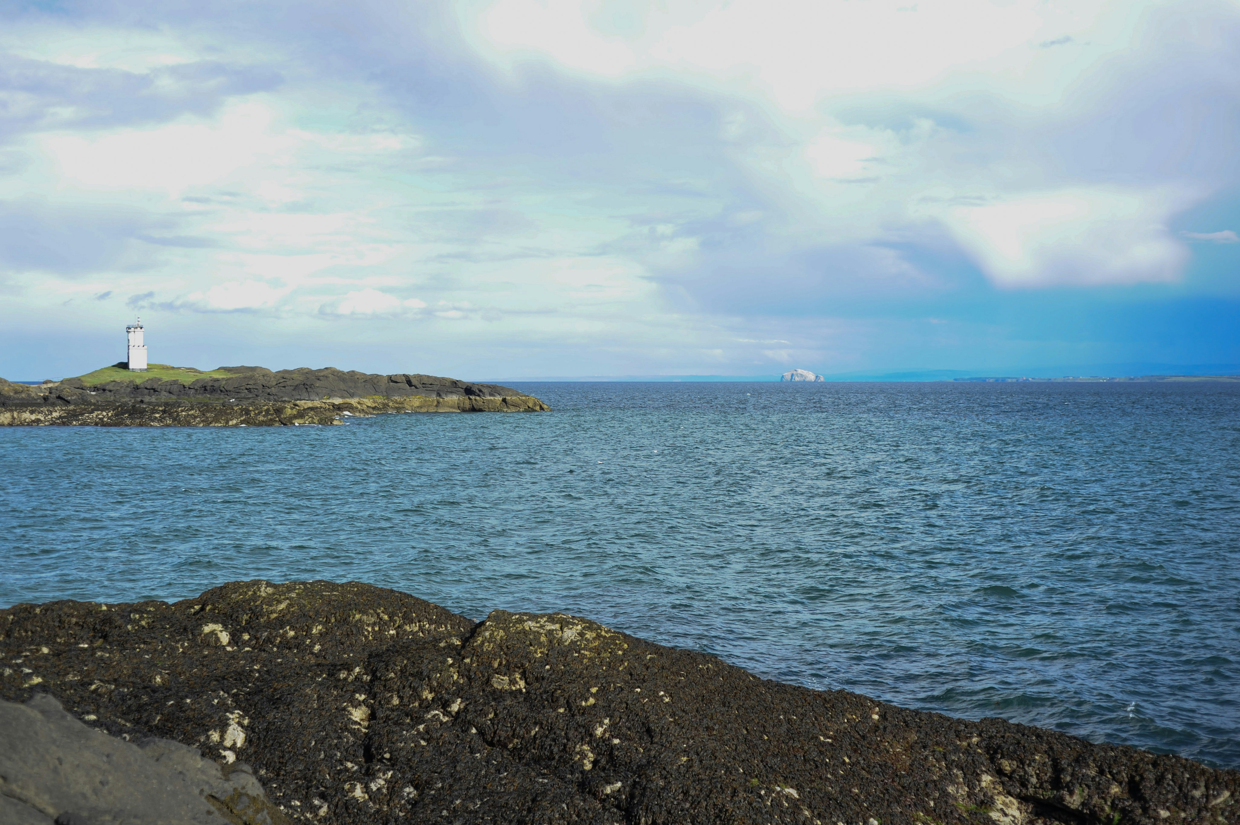 Lighthouse Beyond the Ledge: A Quiet Atlantic Vista
