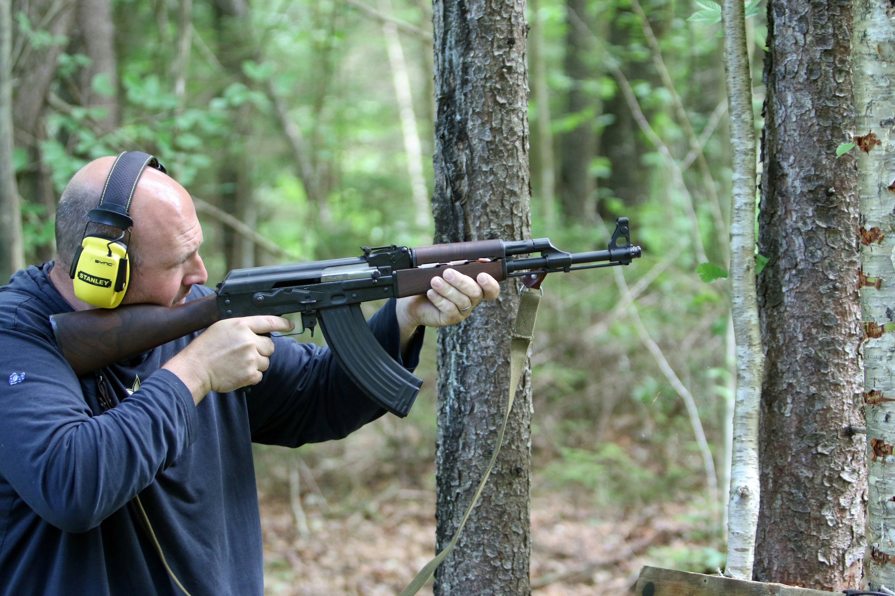 Marksman in the Pines: Precision Pause Between Trees