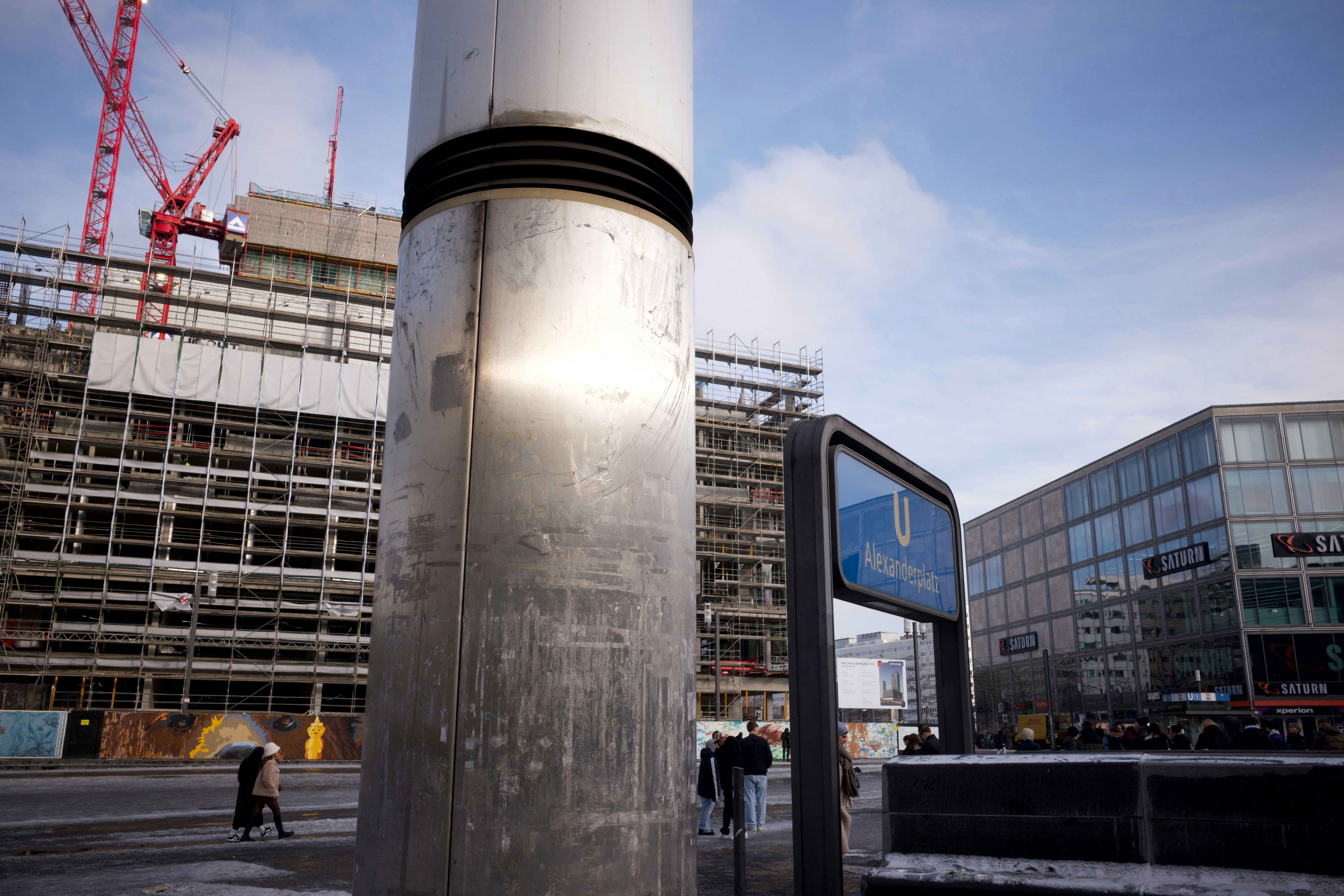 Urban Construction Pulse Framed by a Weathered Column