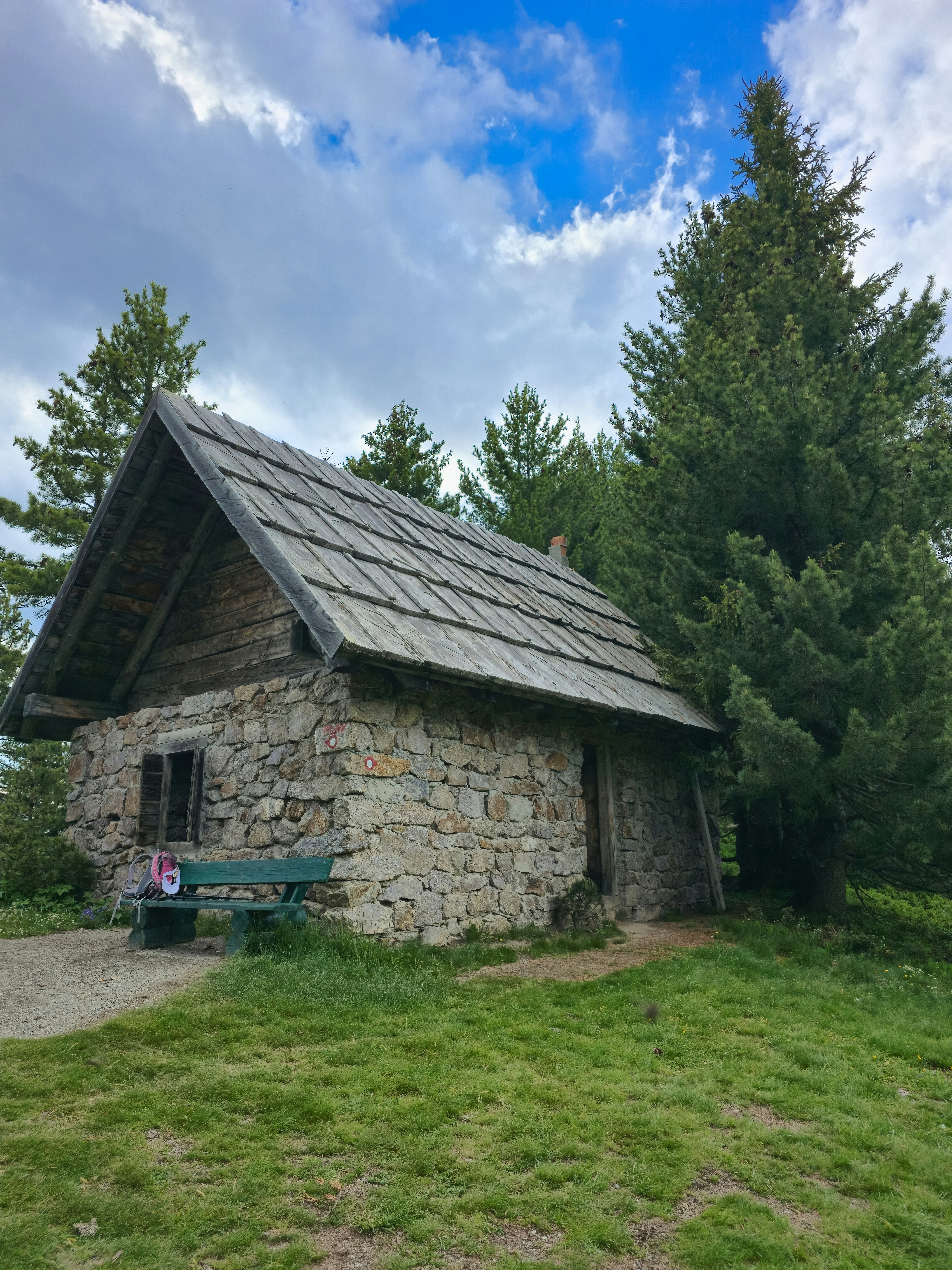 Stone Cabin in a Mountain Clearing