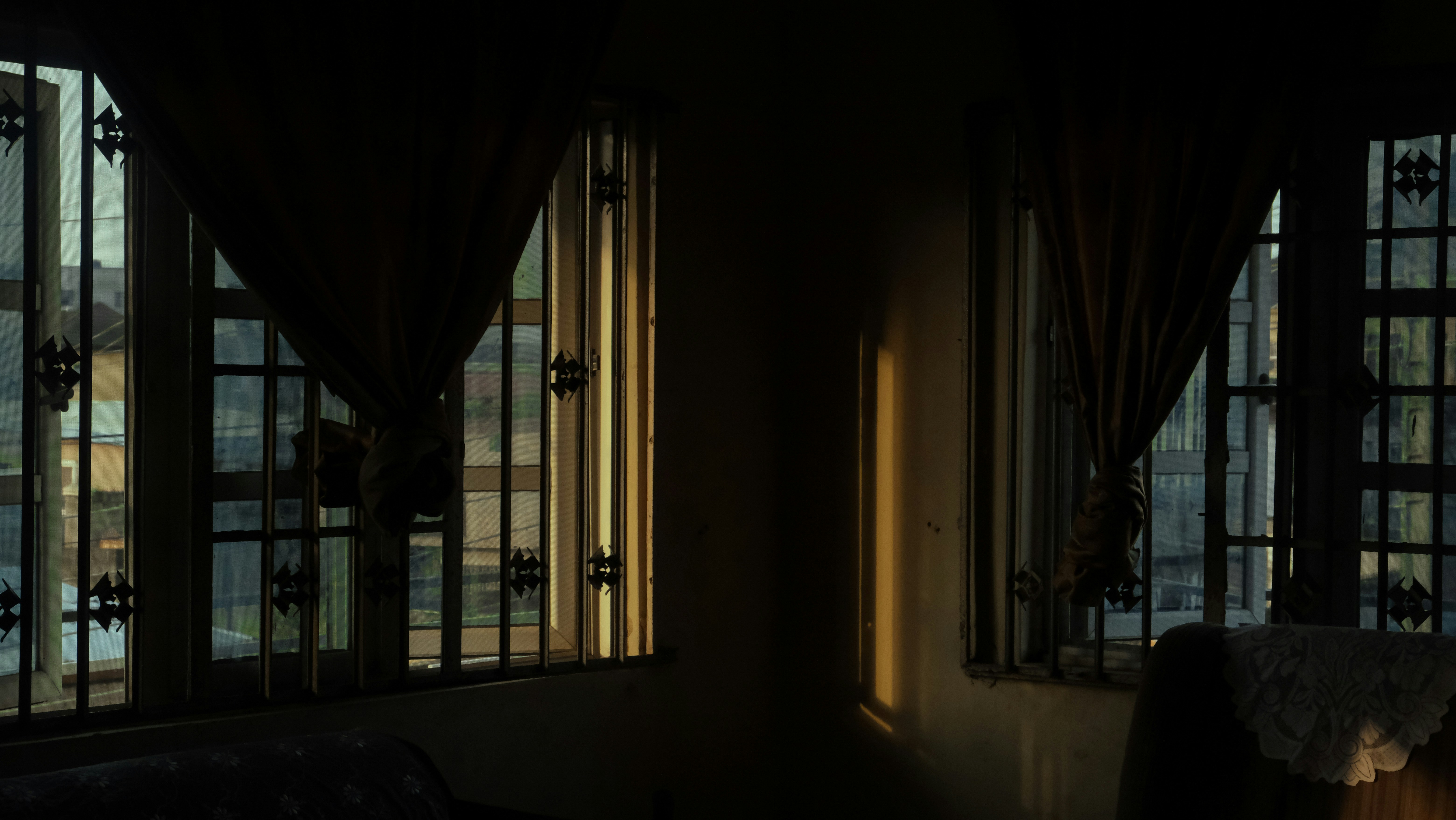 Sunlit gap: a narrow beam revealing a quiet room