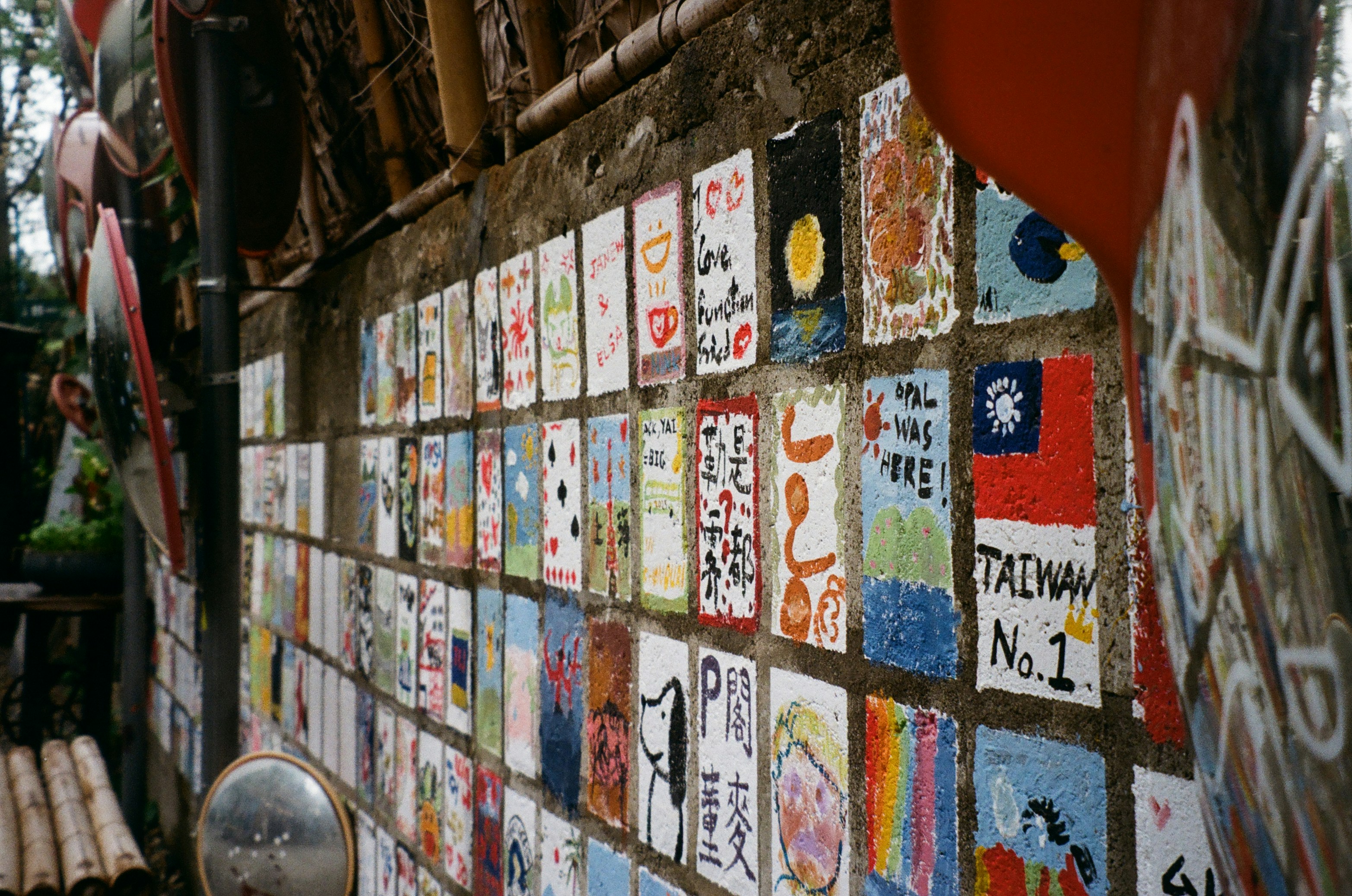 Hand-drawn art on a wall in Baan Kang Wat