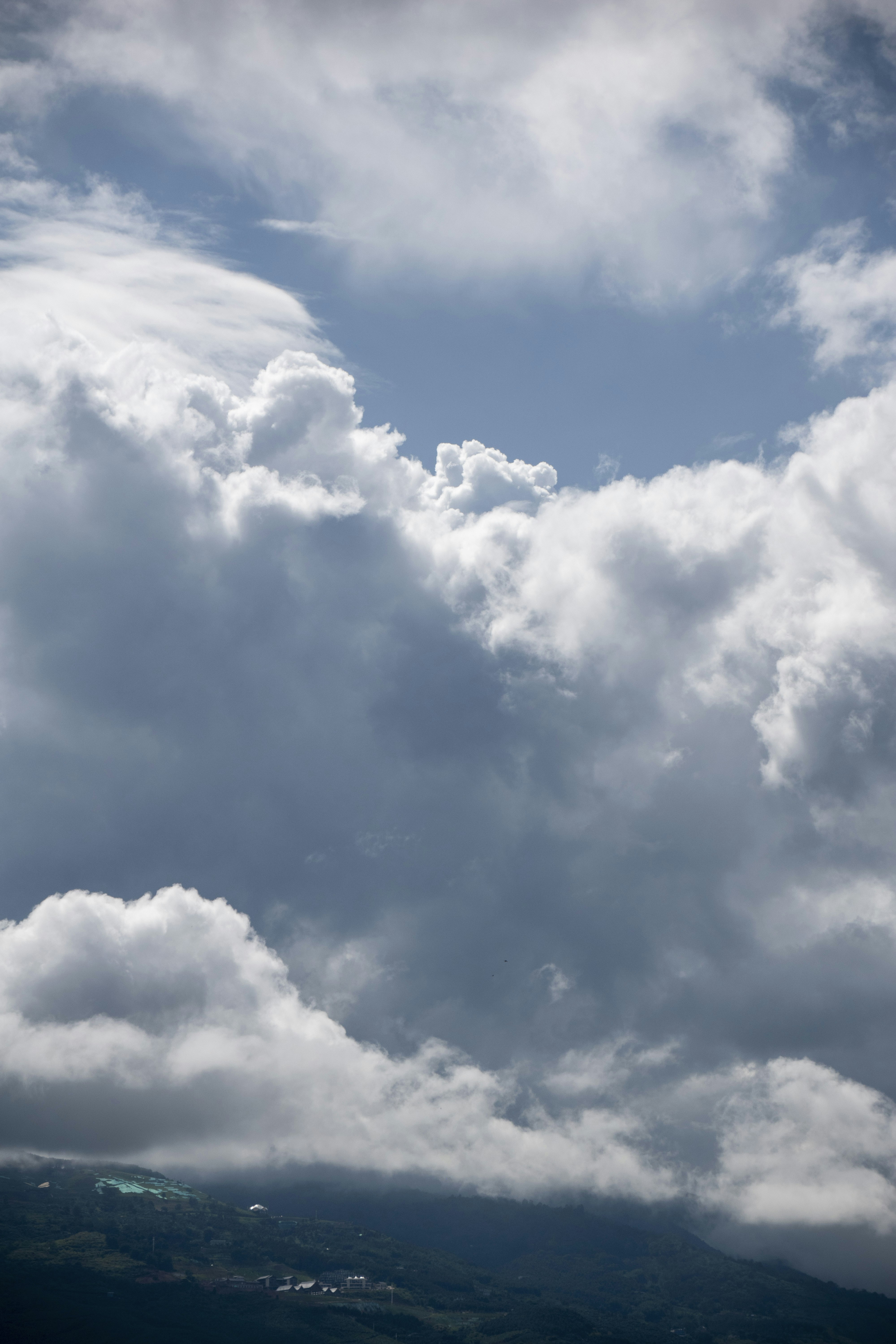 Cloudscape Over a Quiet Mountain Horizon