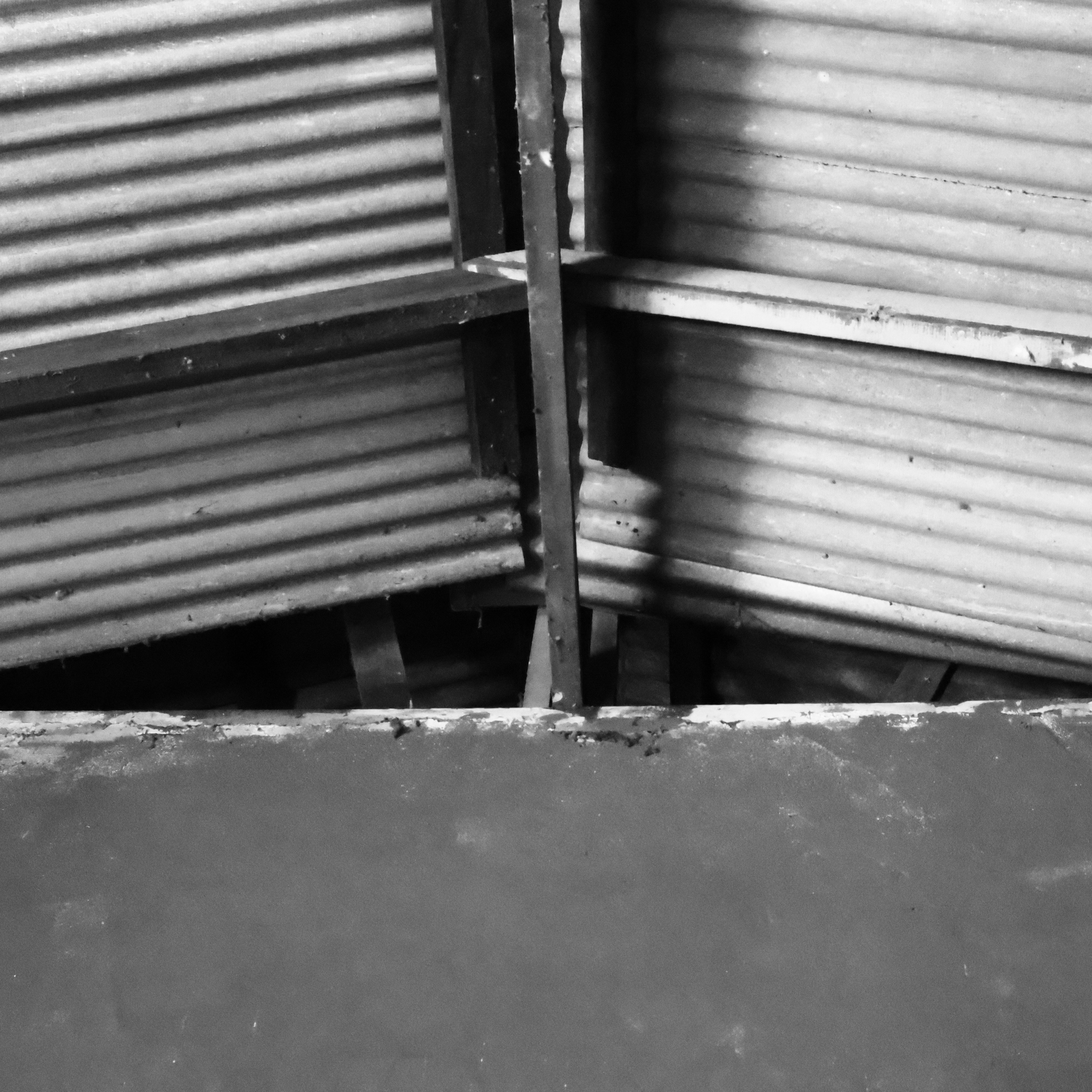 Industrial Shadows: A Cornered Quiet of Corrugated Steel