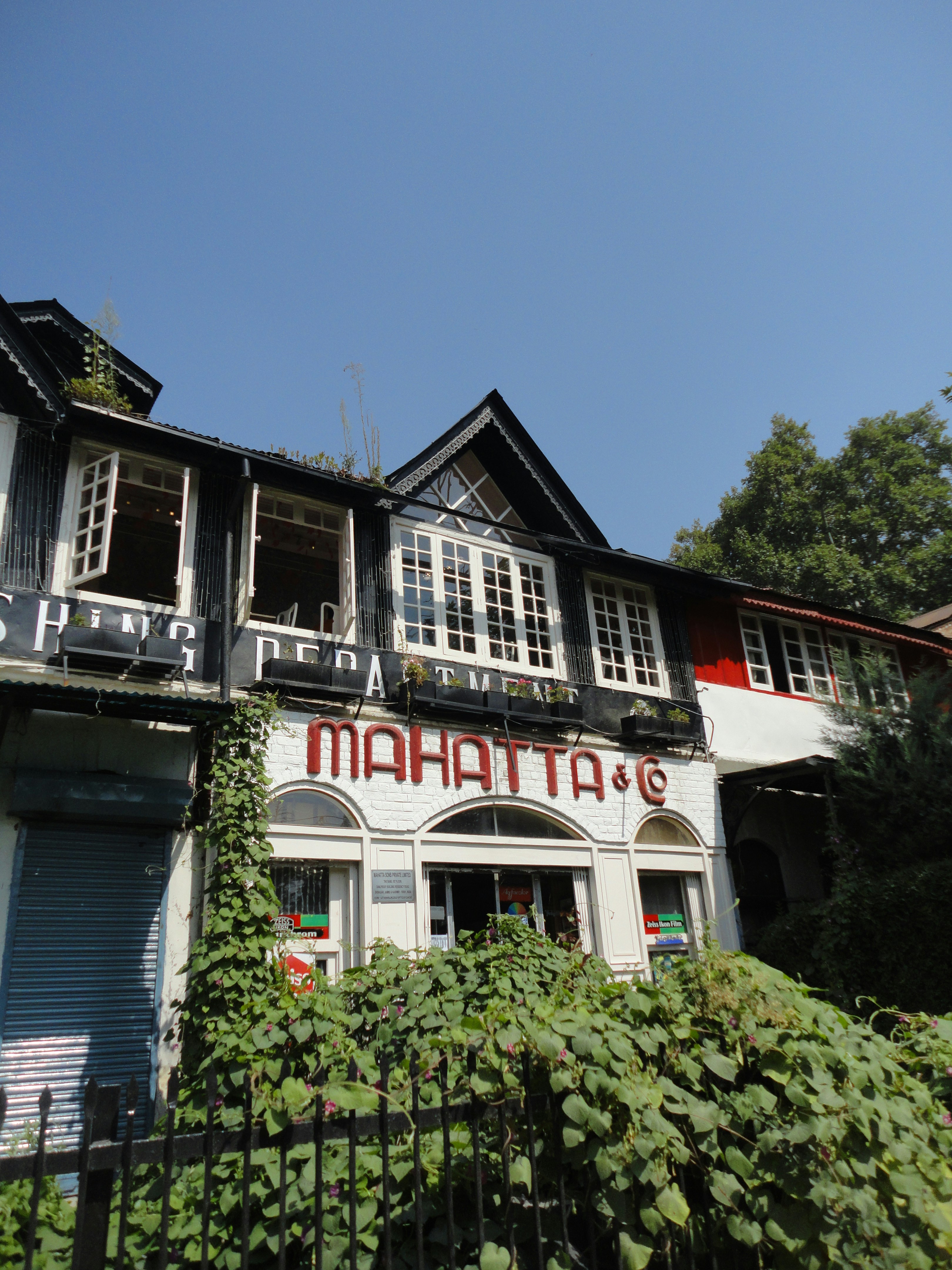 Mahatta Co.: A Sunlit Facade of Forgotten Signs