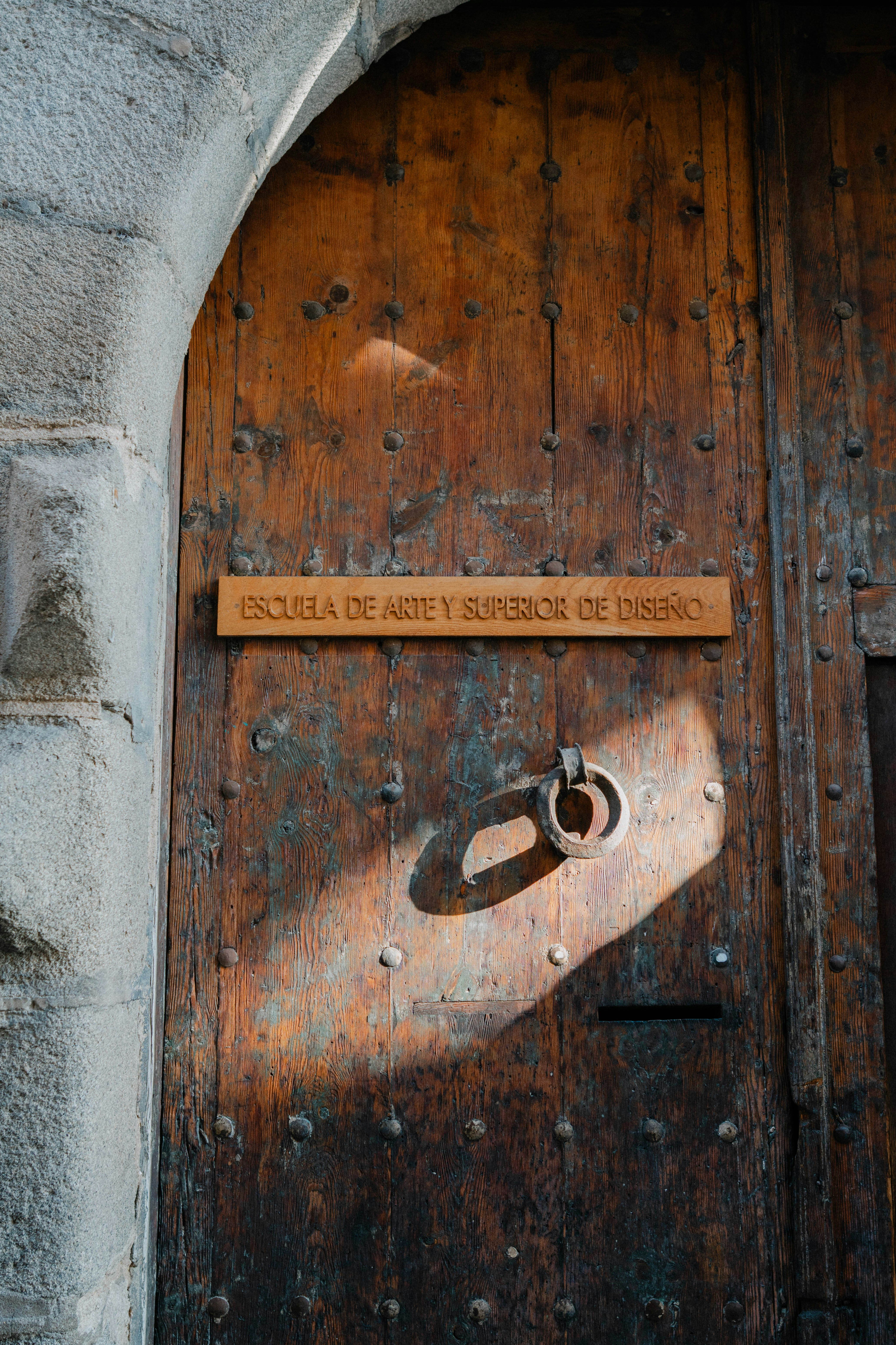Harbor of Oak—A Weathered Door with Ring and Passage