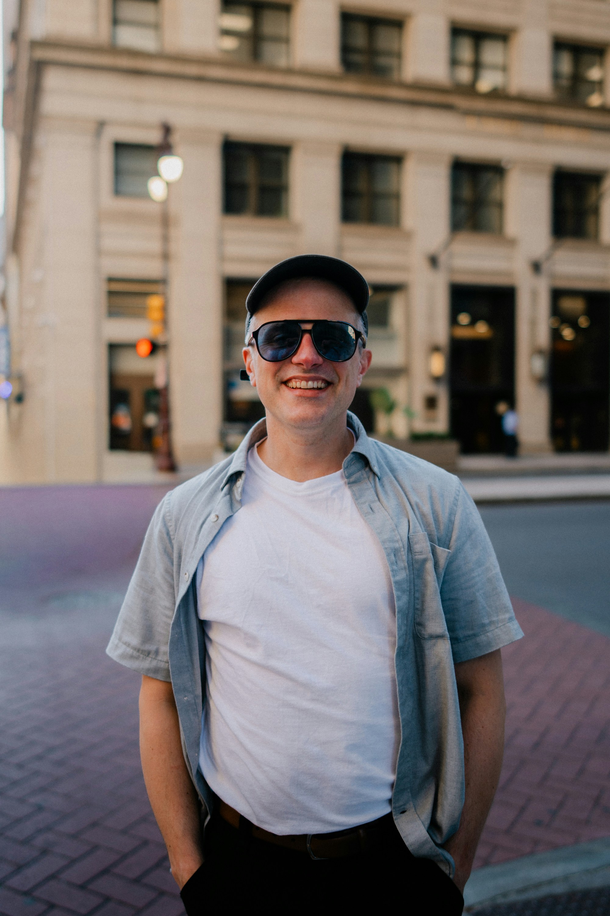 Smiling in the City: Casual Confidence Outside the Old Marble