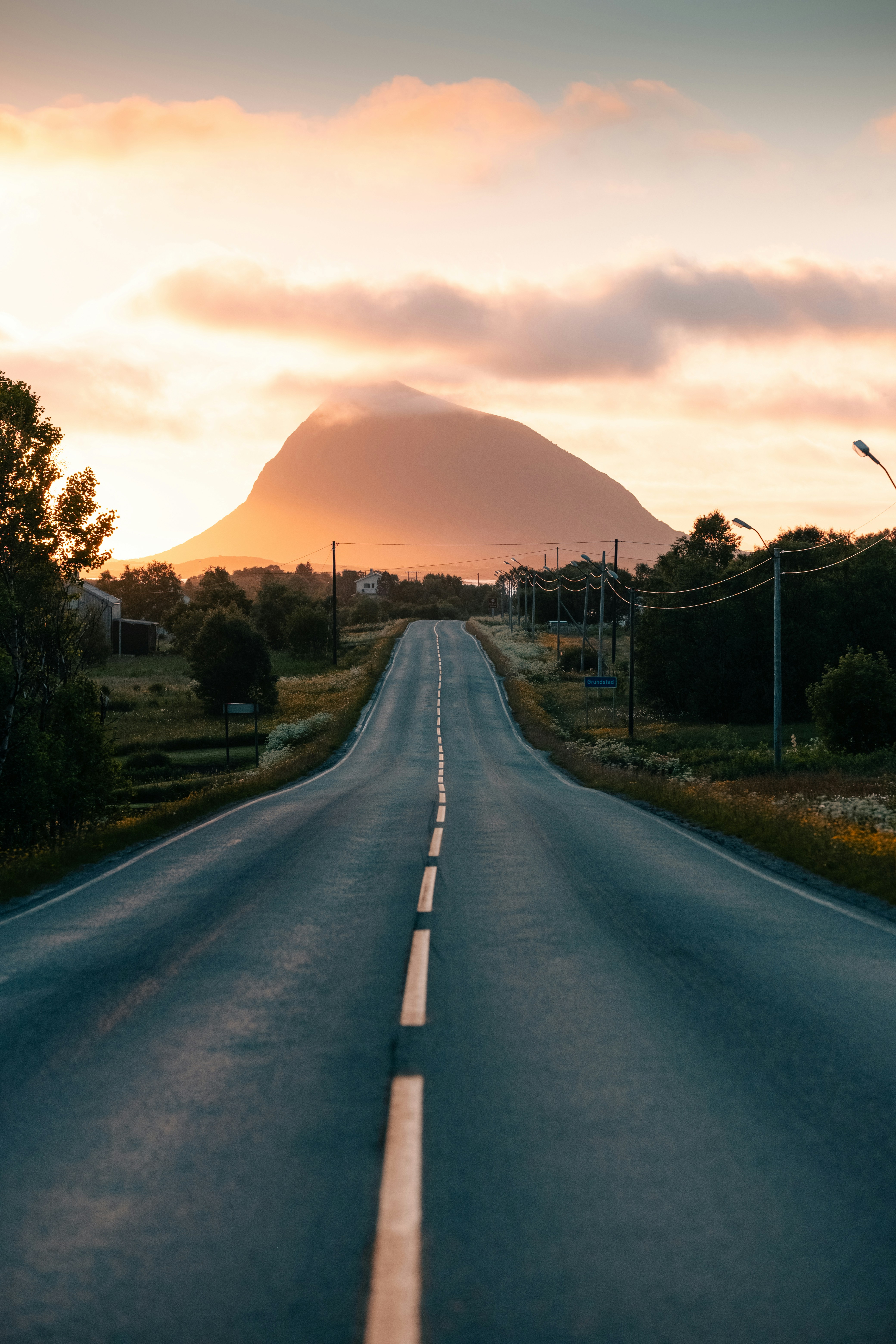Toward the Quiet Summit: A Road unfolds beneath a waking mountain