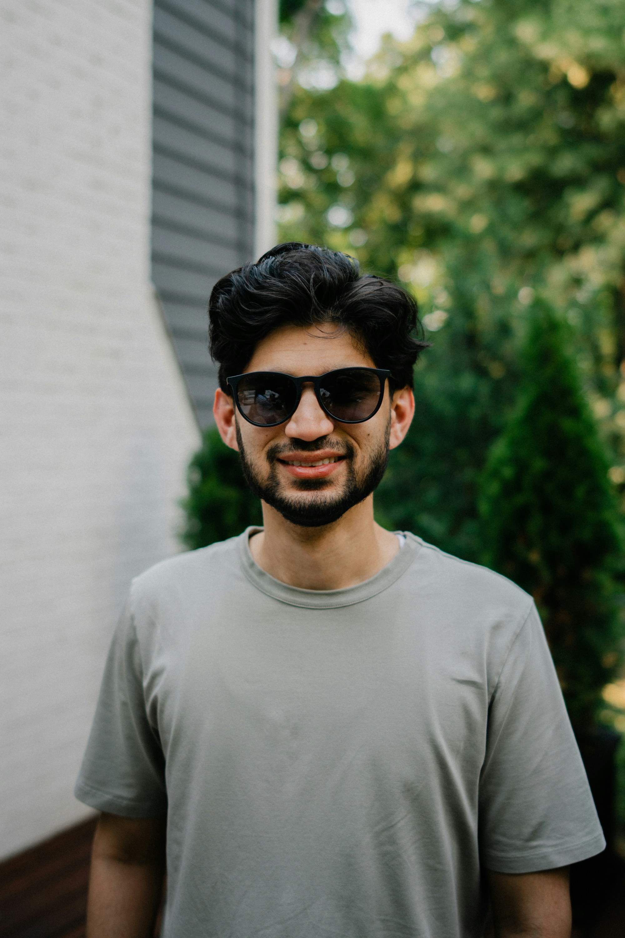 Shadowed Confidence: A Portrait in Soft Urban Light