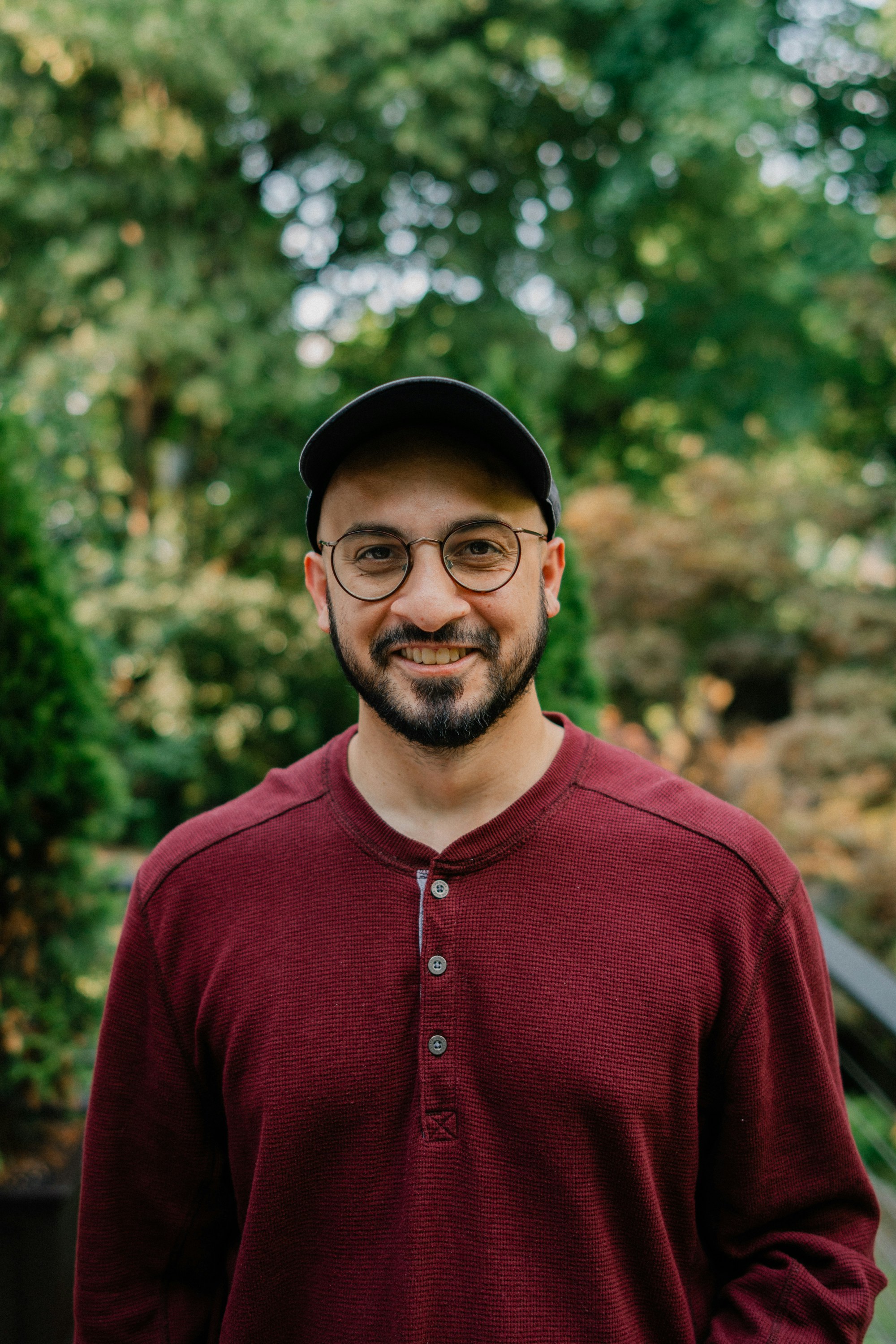 Portrait in the Park: Quiet Confidence Under a Cap