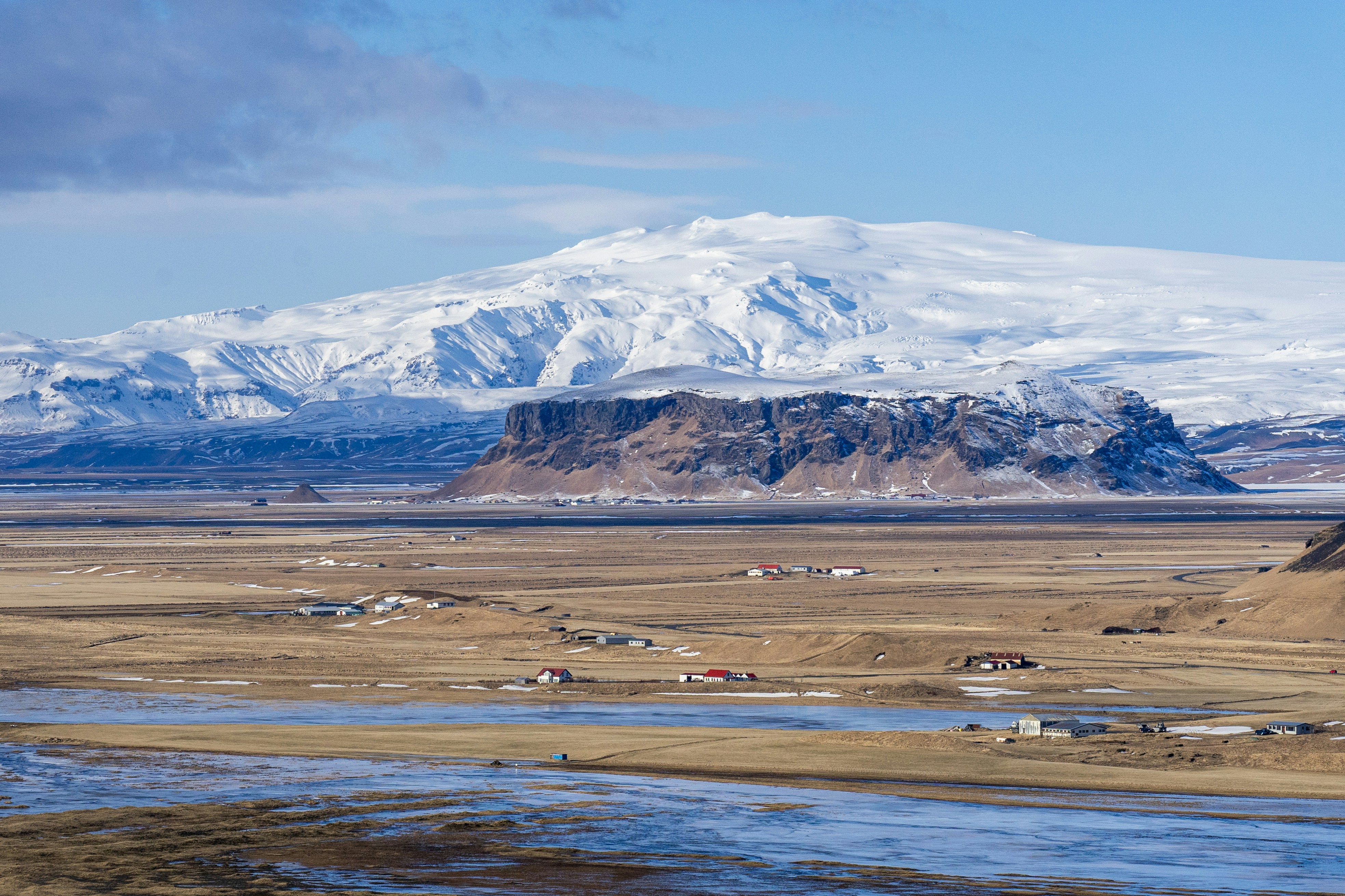 Snowbound Horizon: A Quiet Icelandic Plain Under a Glacial Crest