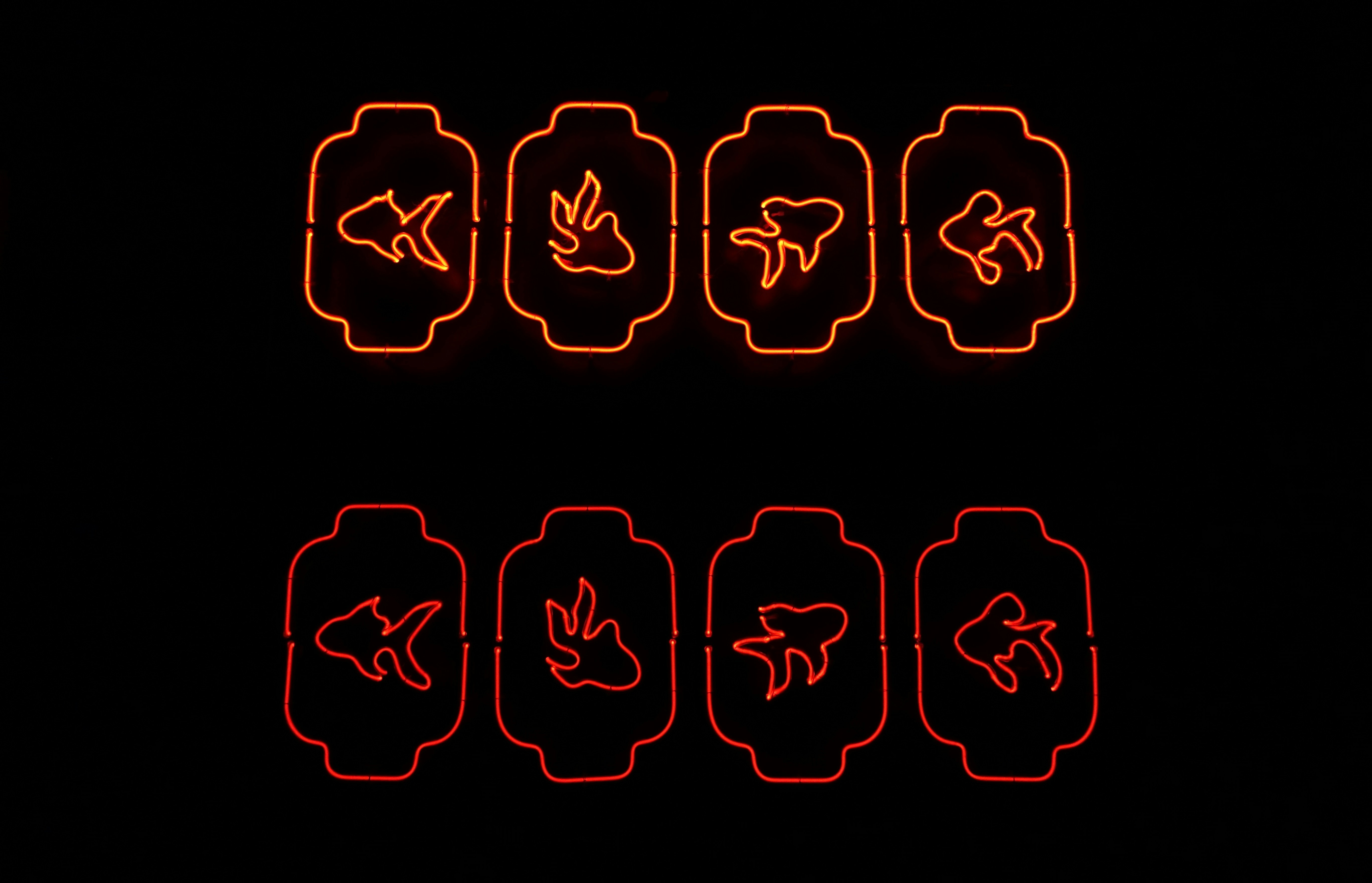 Neon Hands: Dual Row Signaling Glyphs in Red and Orange