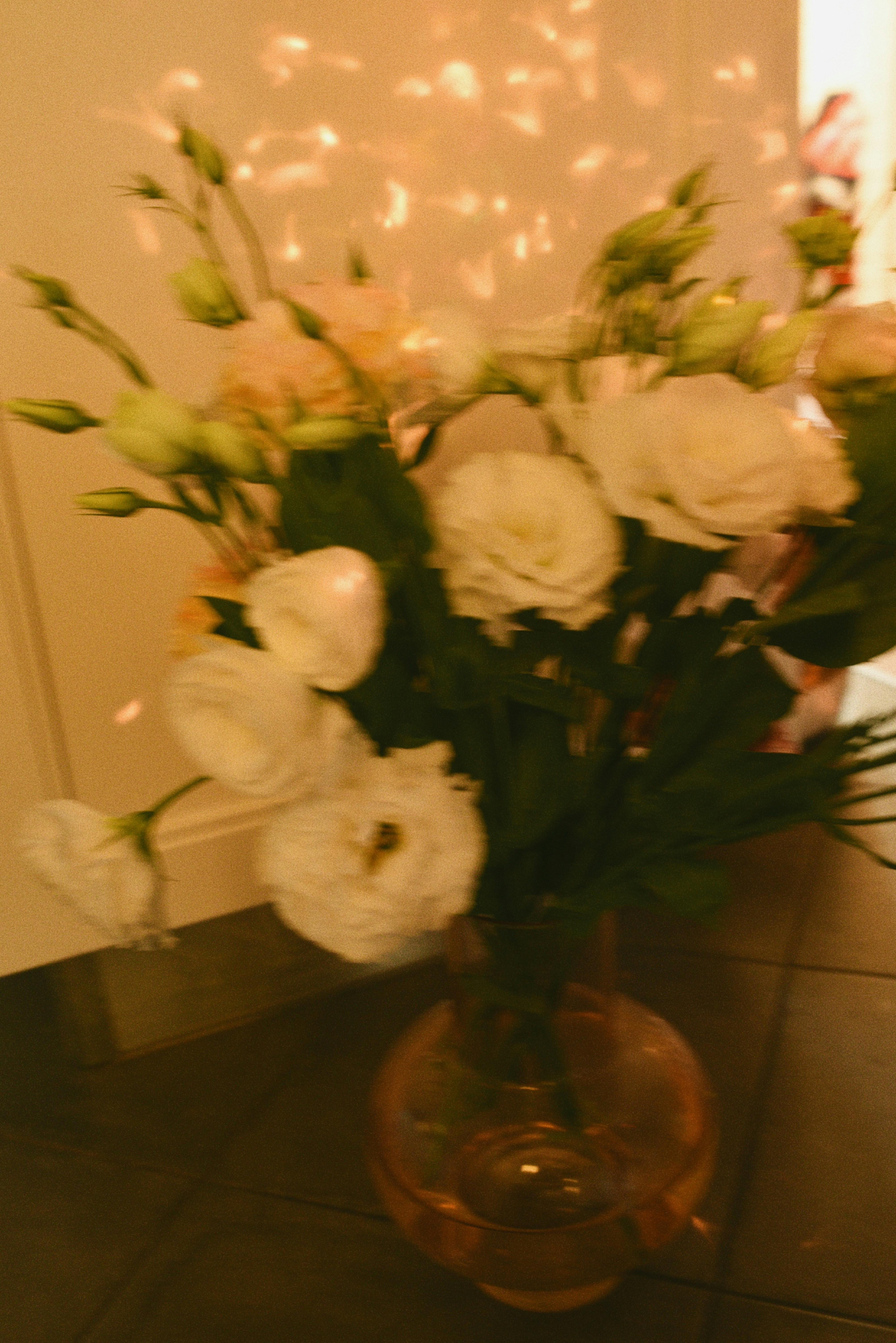 Petals in Motion: a Sunset Vase of White Blooms