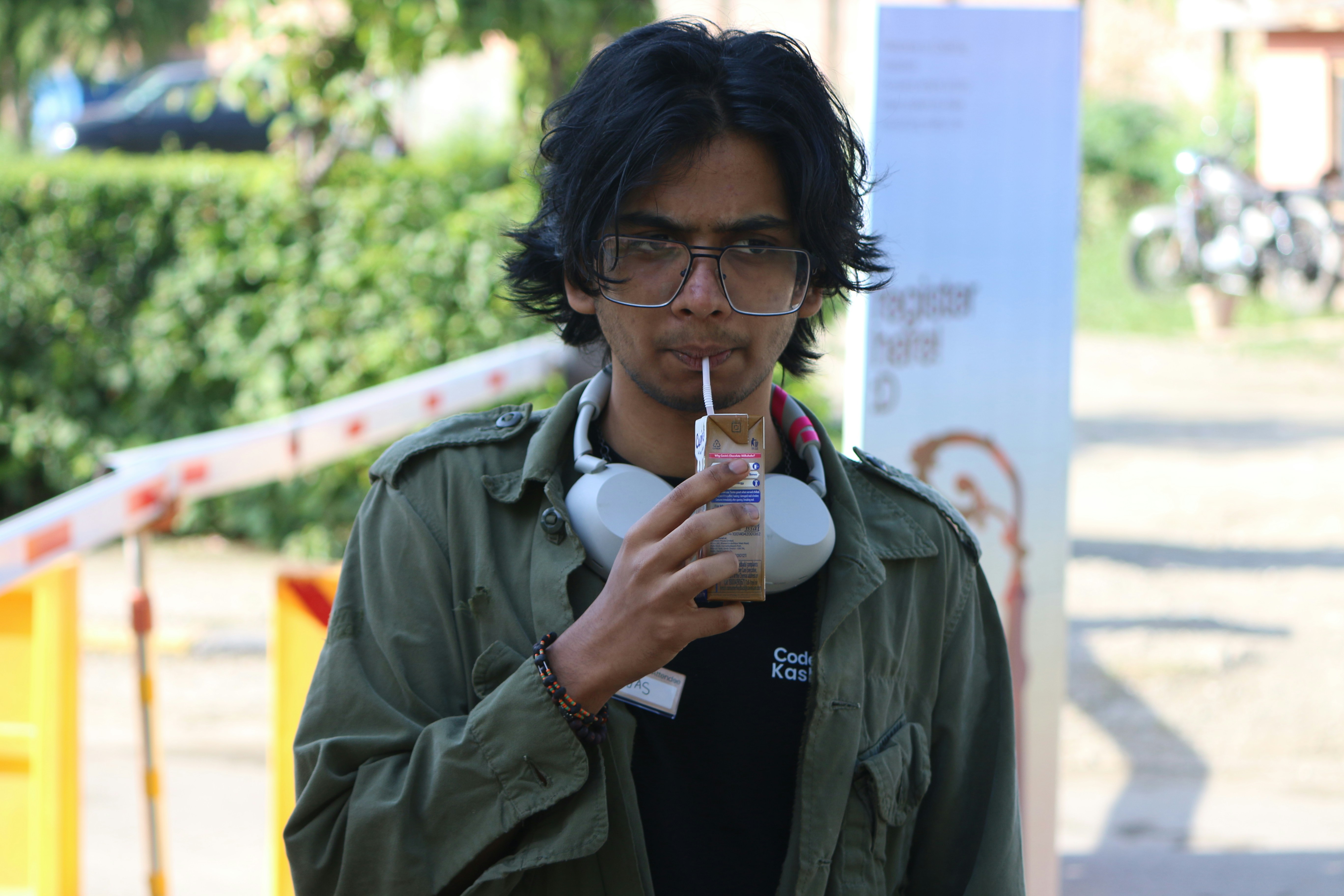 Sipping Focus: A Quiet Moment in the Campus Corridor