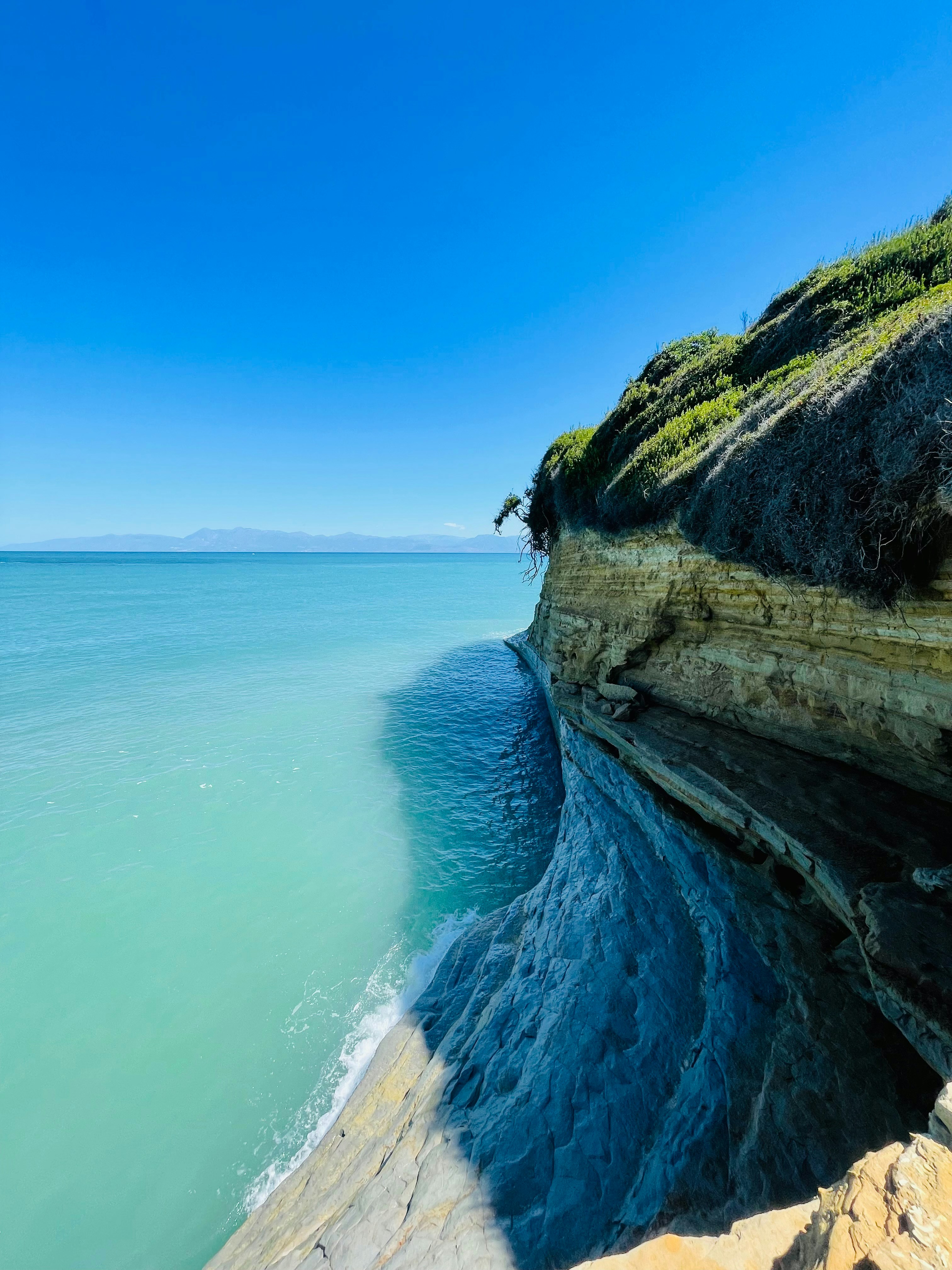 Cliffscape at the Edge of Turquoise Calm