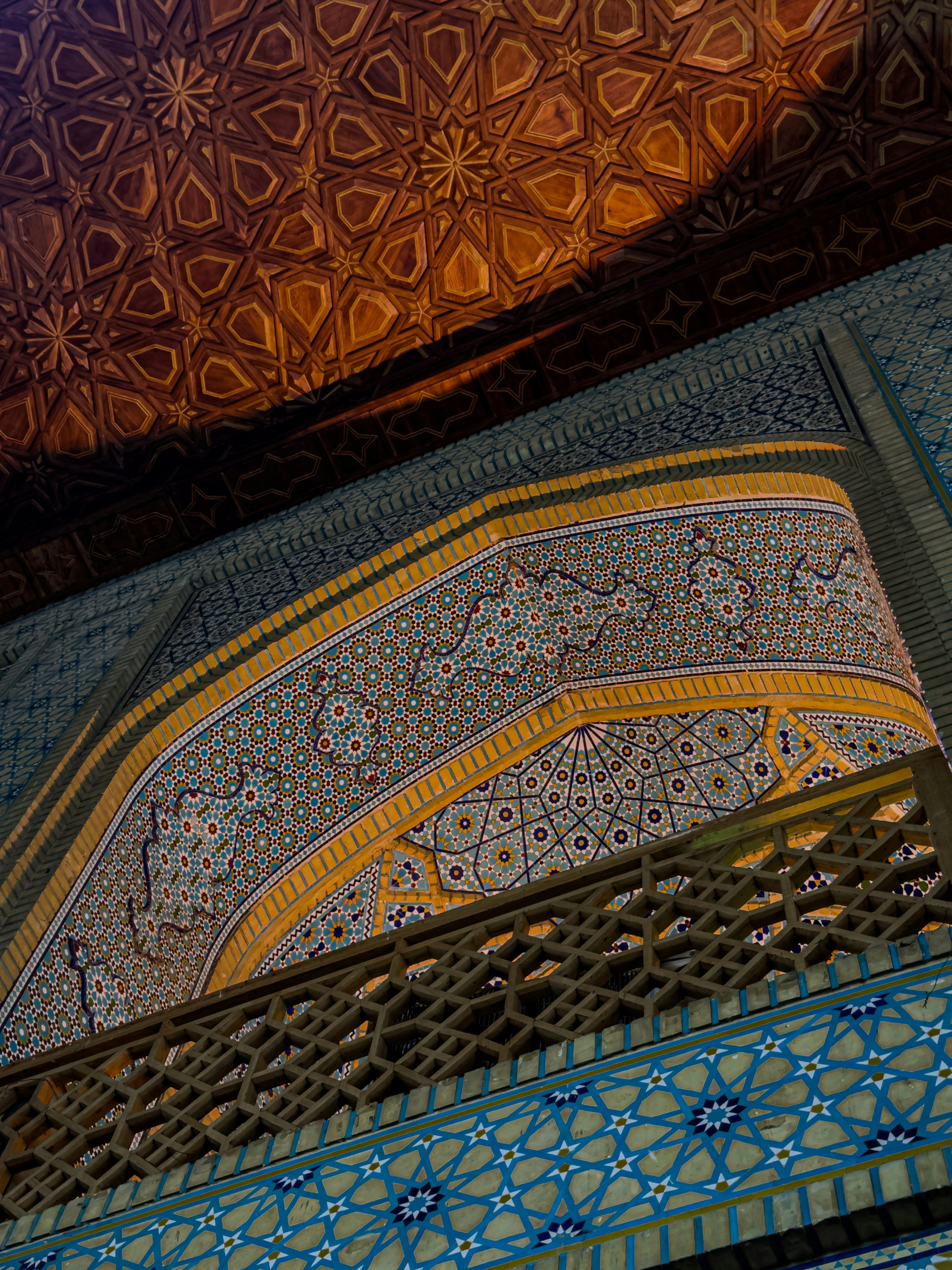 Decorative Archway in Mosaic Tilework with Shadowed Ceiling