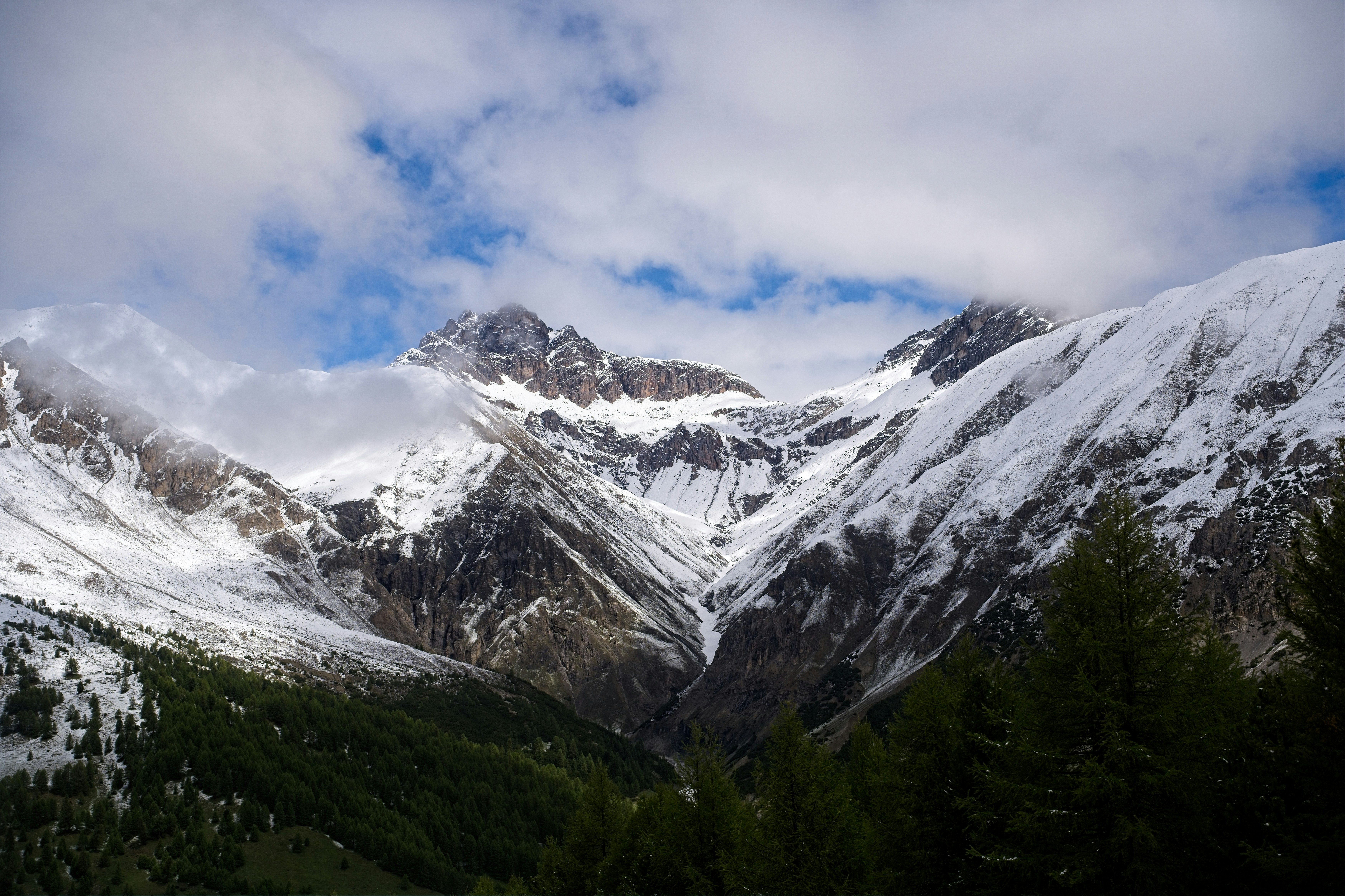 Snowbound Peaks at Dappled Skies