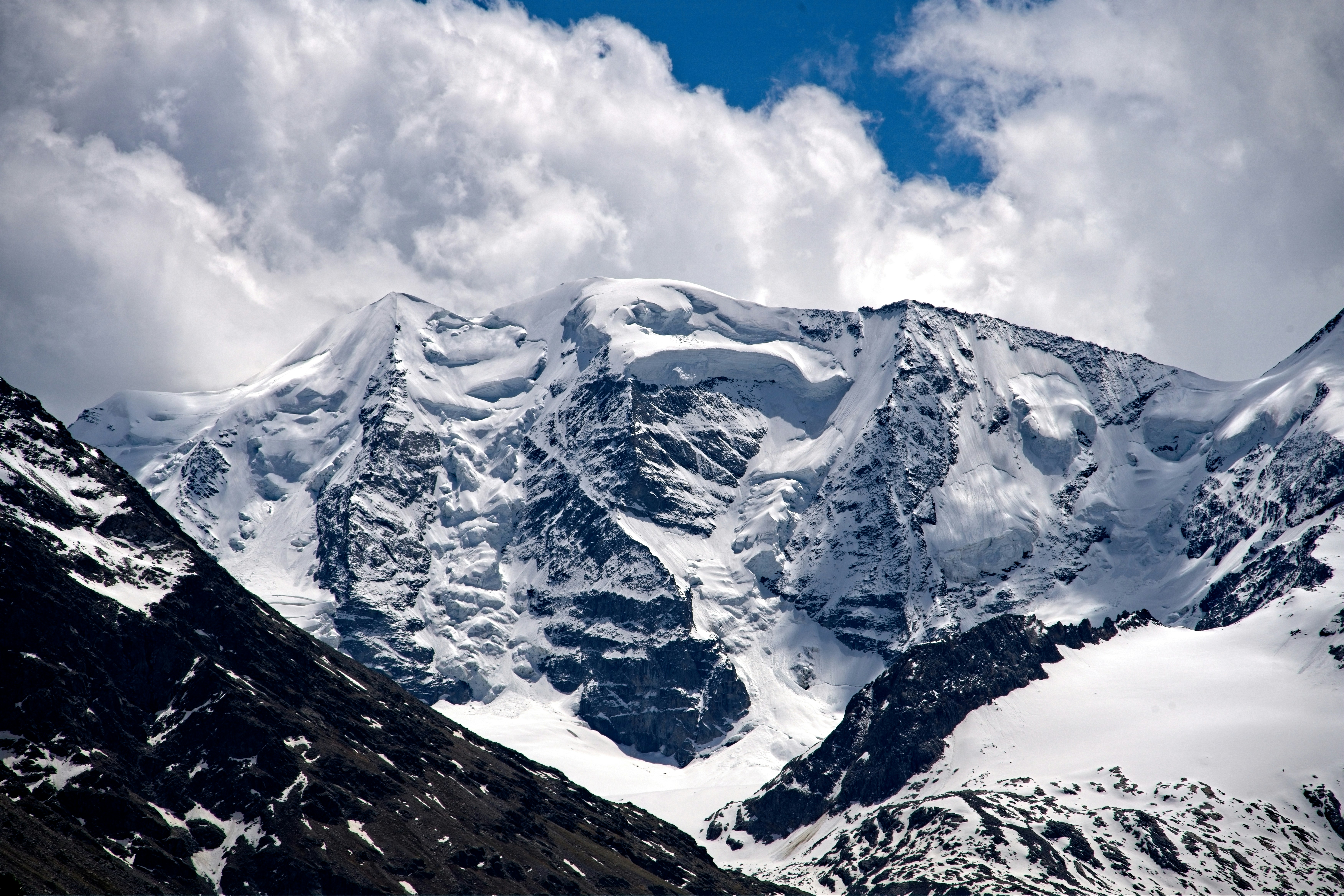 Snow-Capped Peaks under Luminous Sky