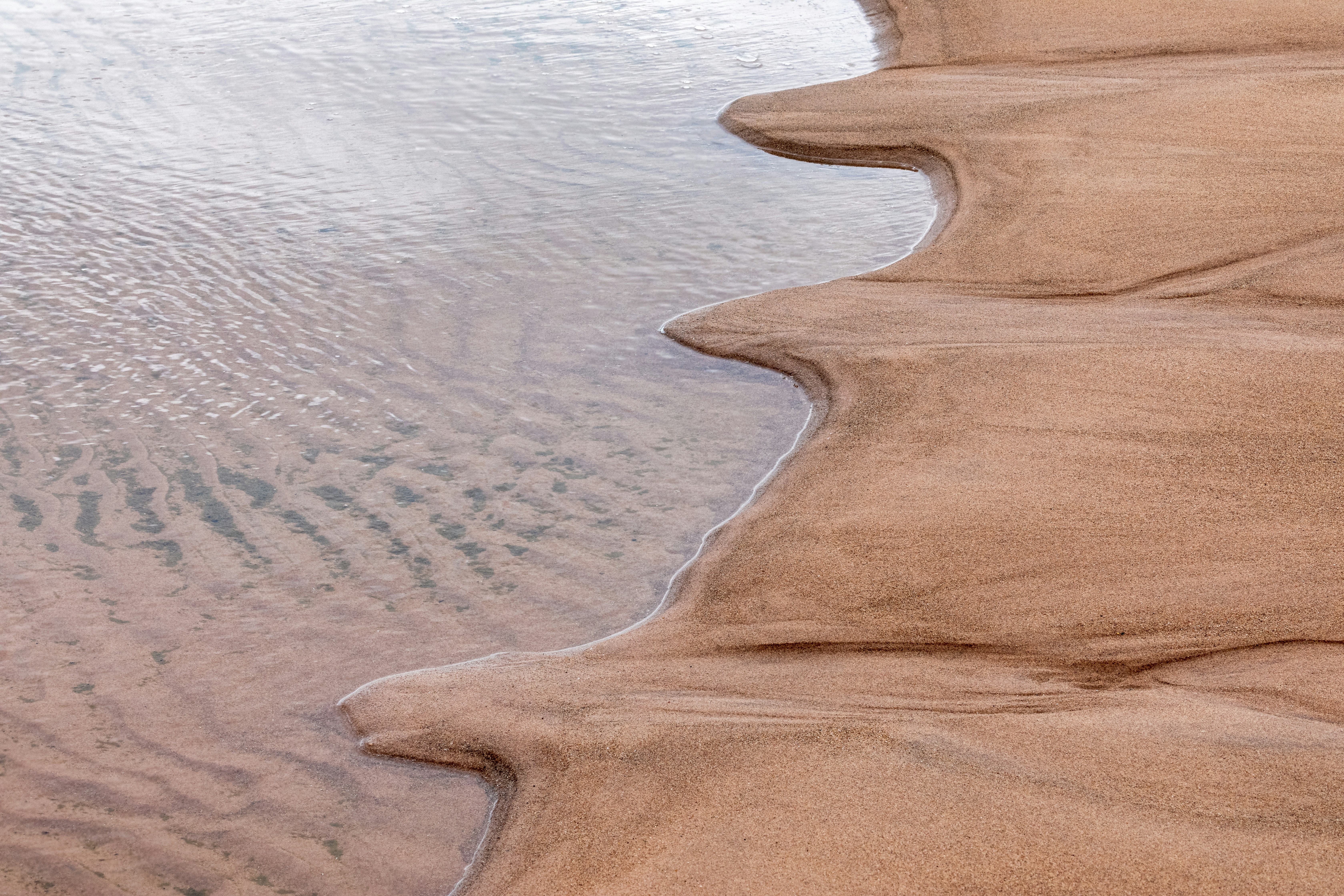 Wind-Carved Sand Ridges Meeting Tidal Remnant