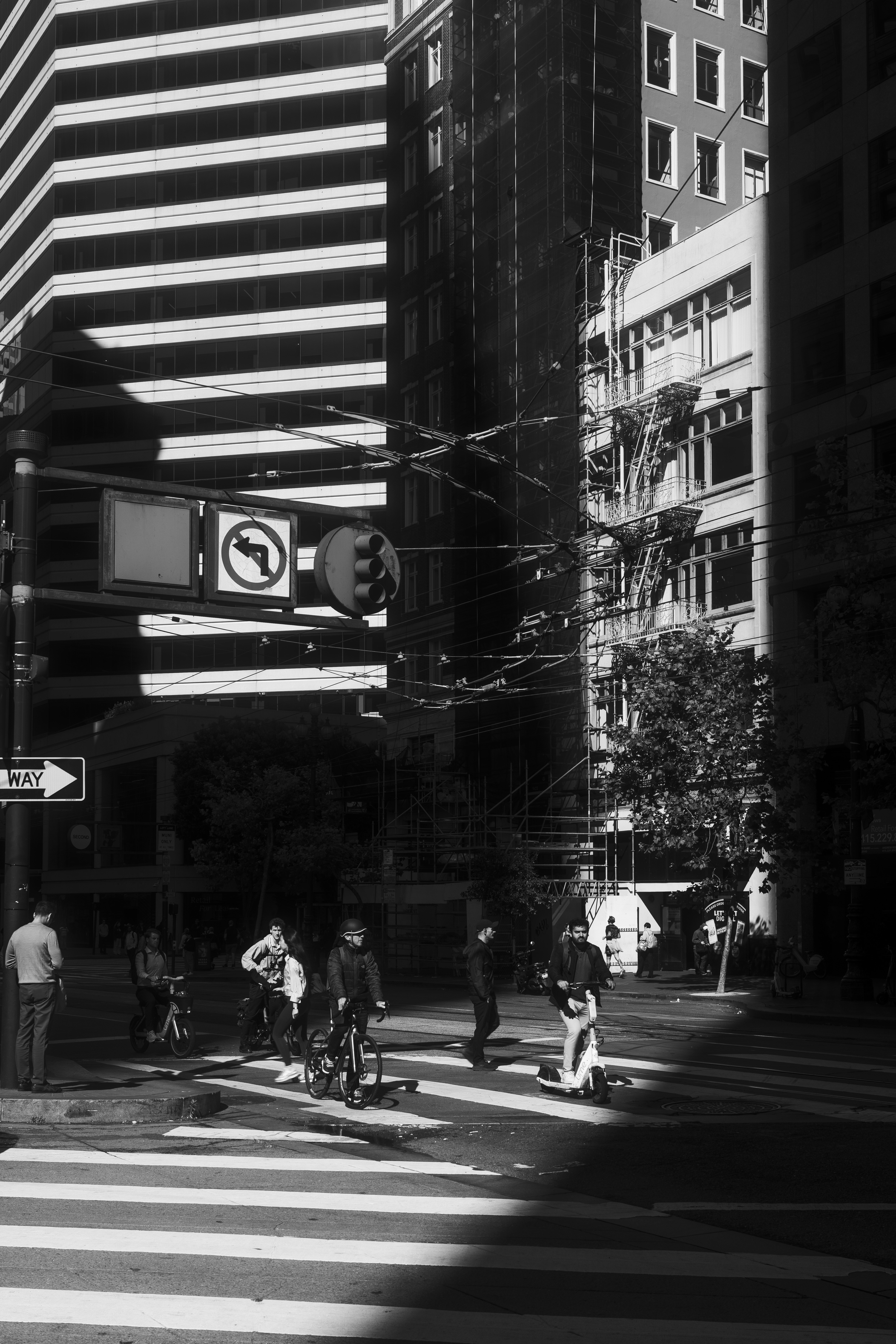 Crossing Shadows: Urban Motion Beneath Monochrome Skies