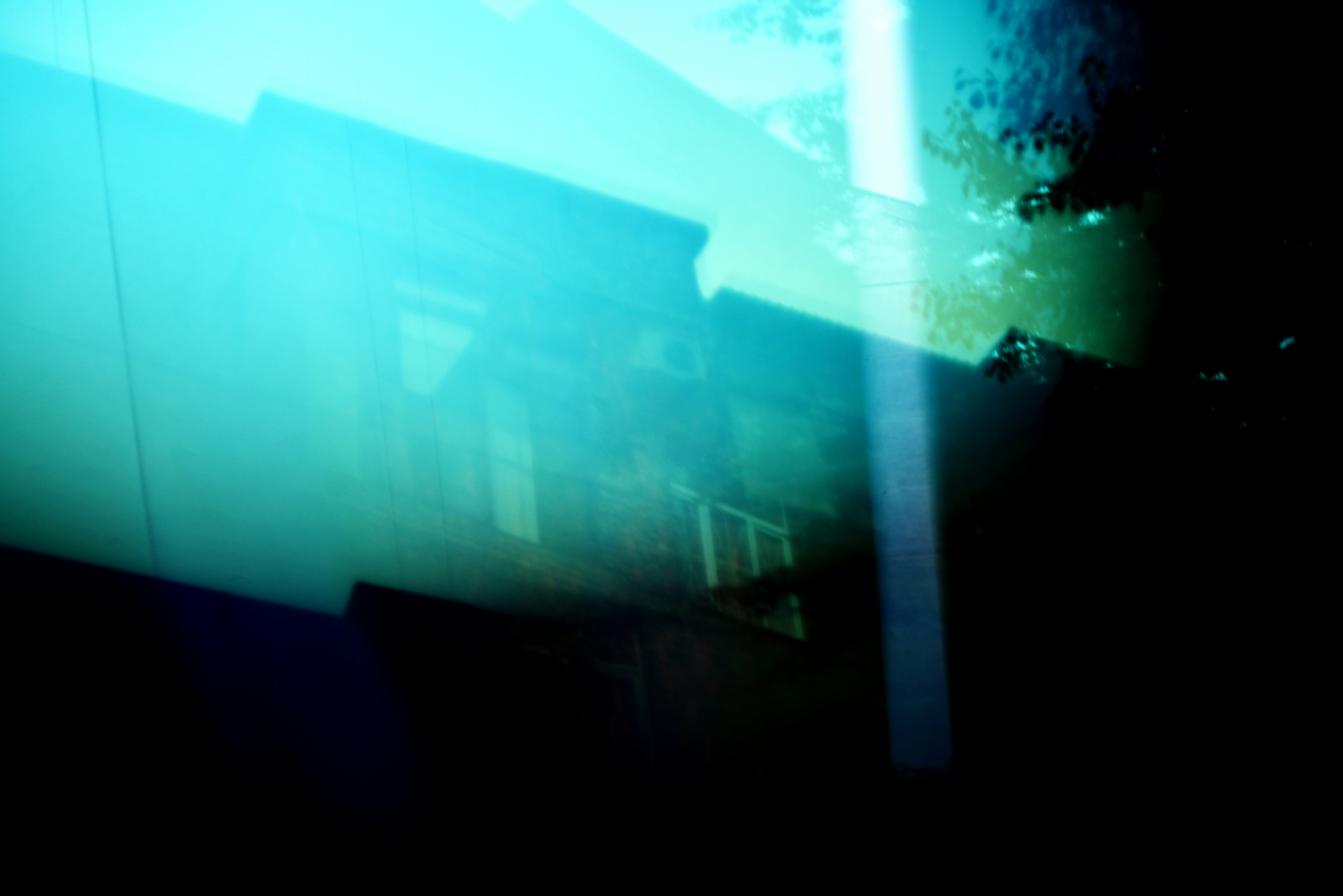 Aqua Veil Over a Quiet Facade