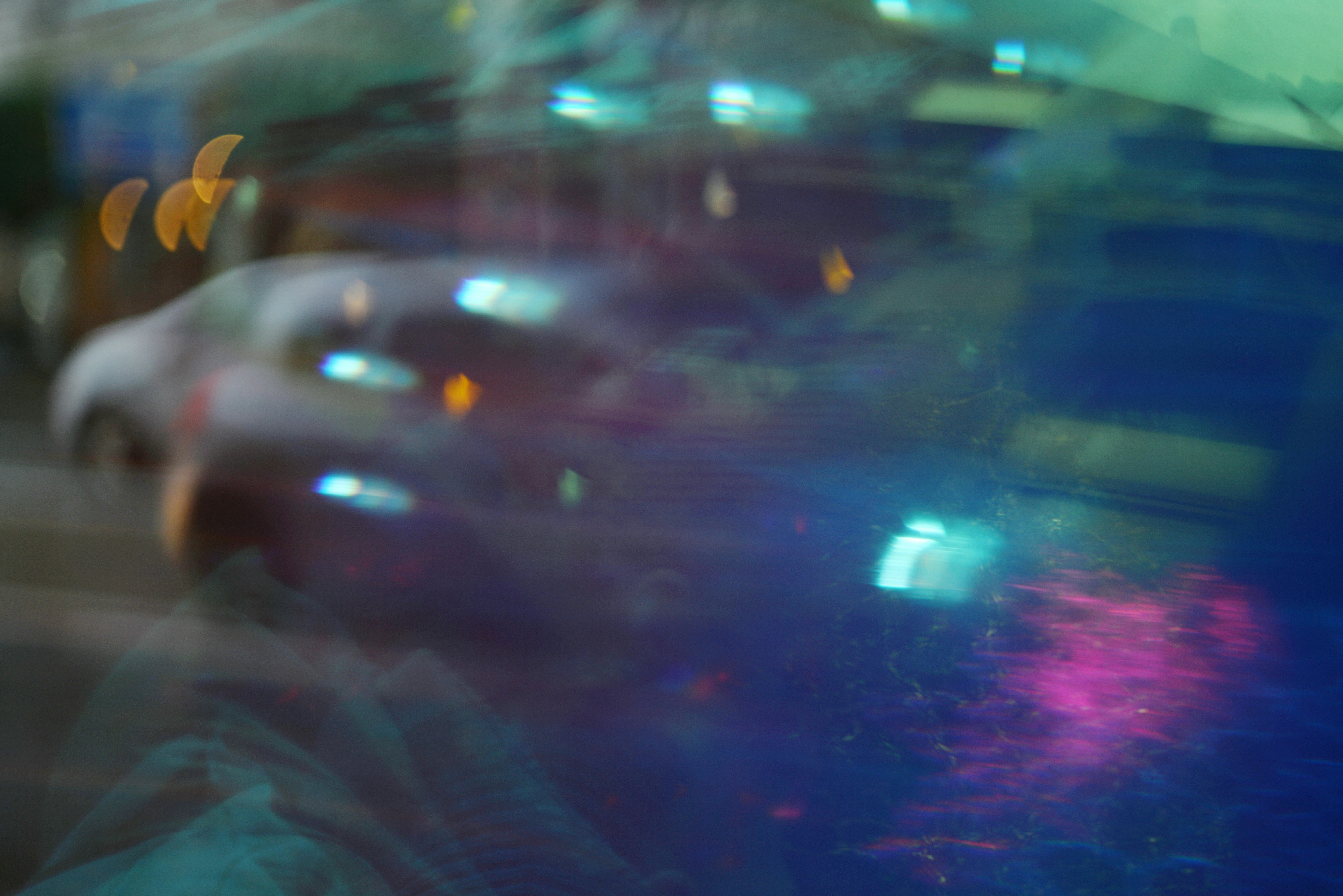 Prismatic Reflections: A Glimpse Through Neon Ripples