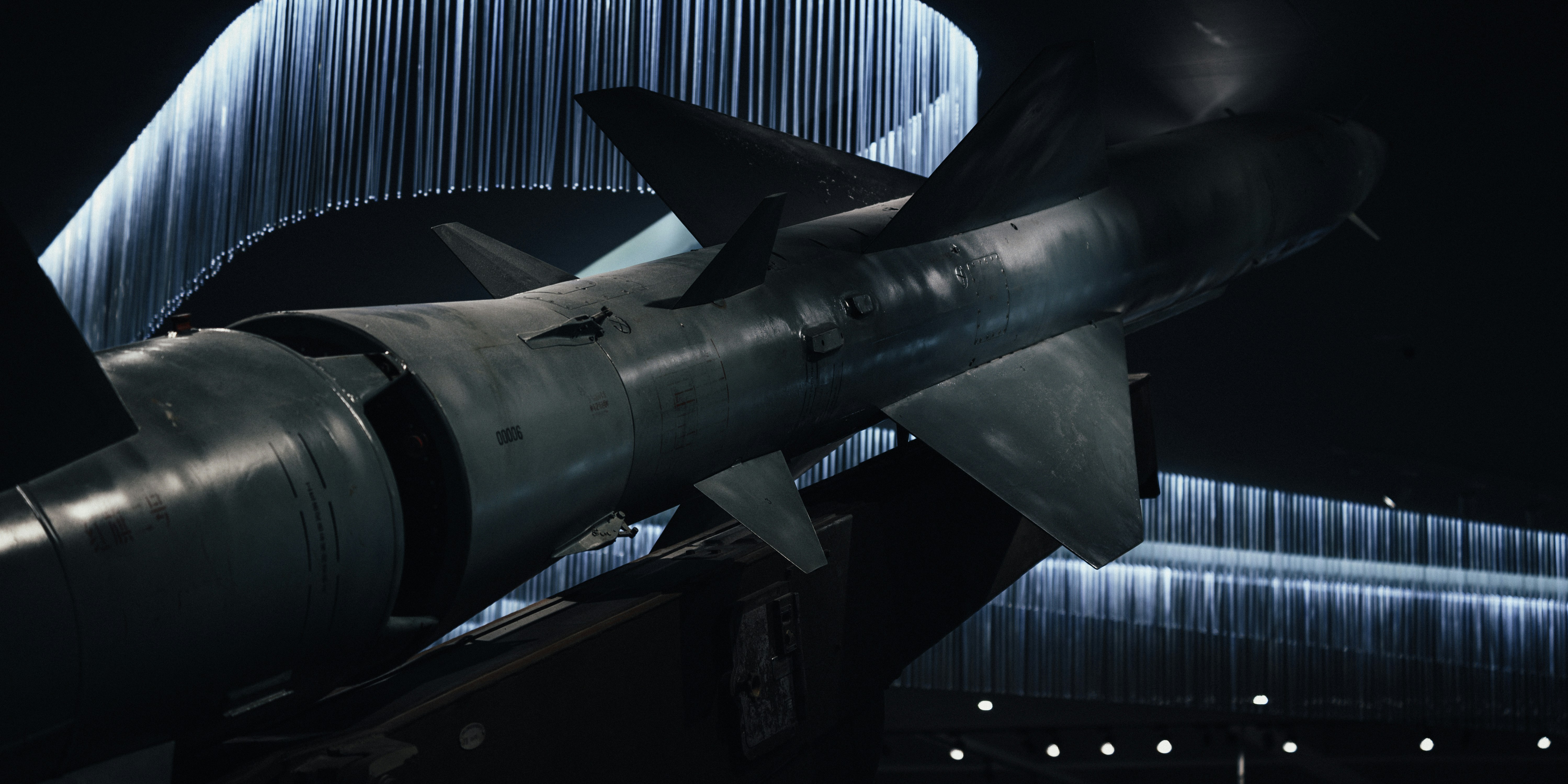Night Launch: A Missile poised beneath a blue-lit arc