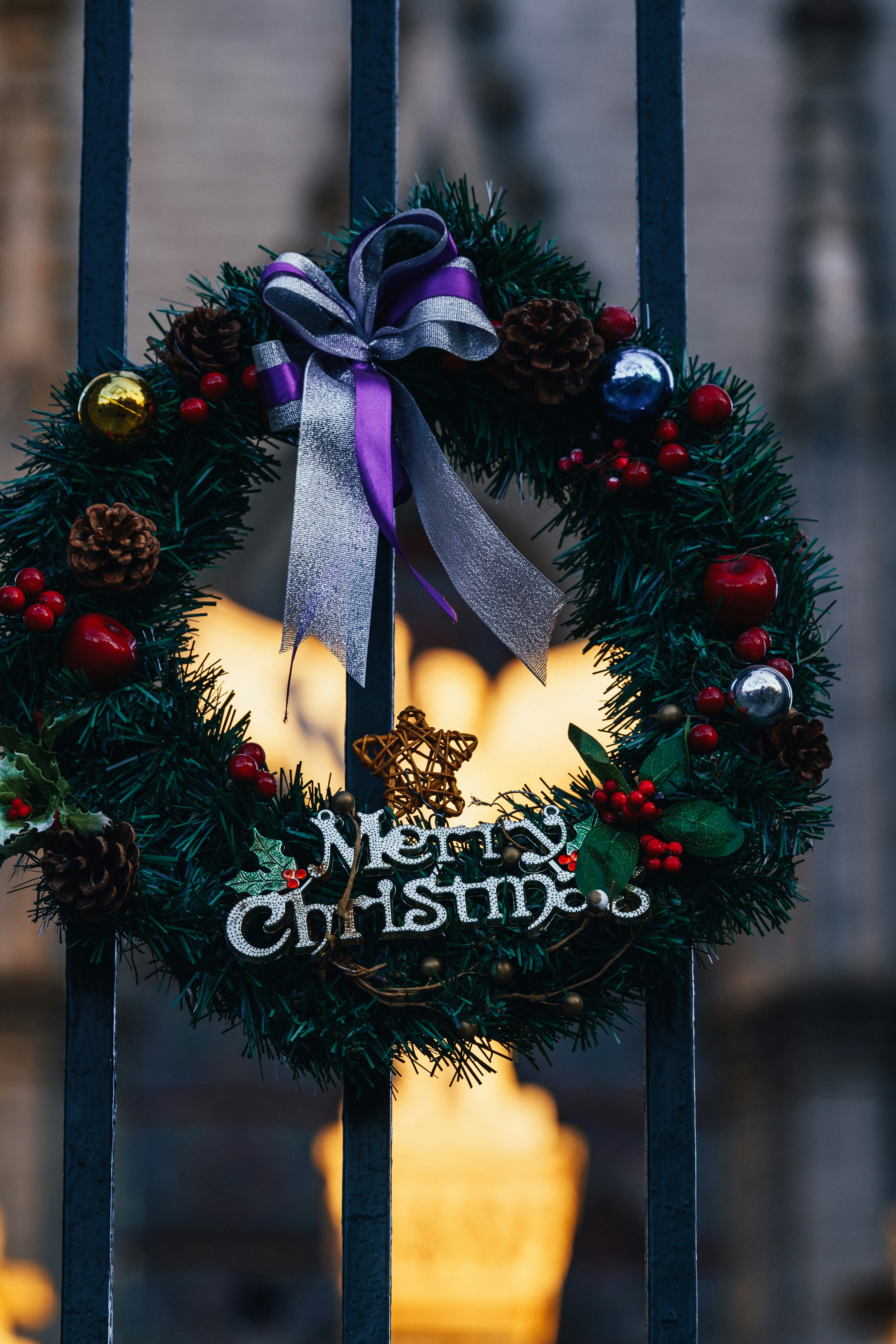 Holly Wreath Graced by Ribbon and Warm Glow