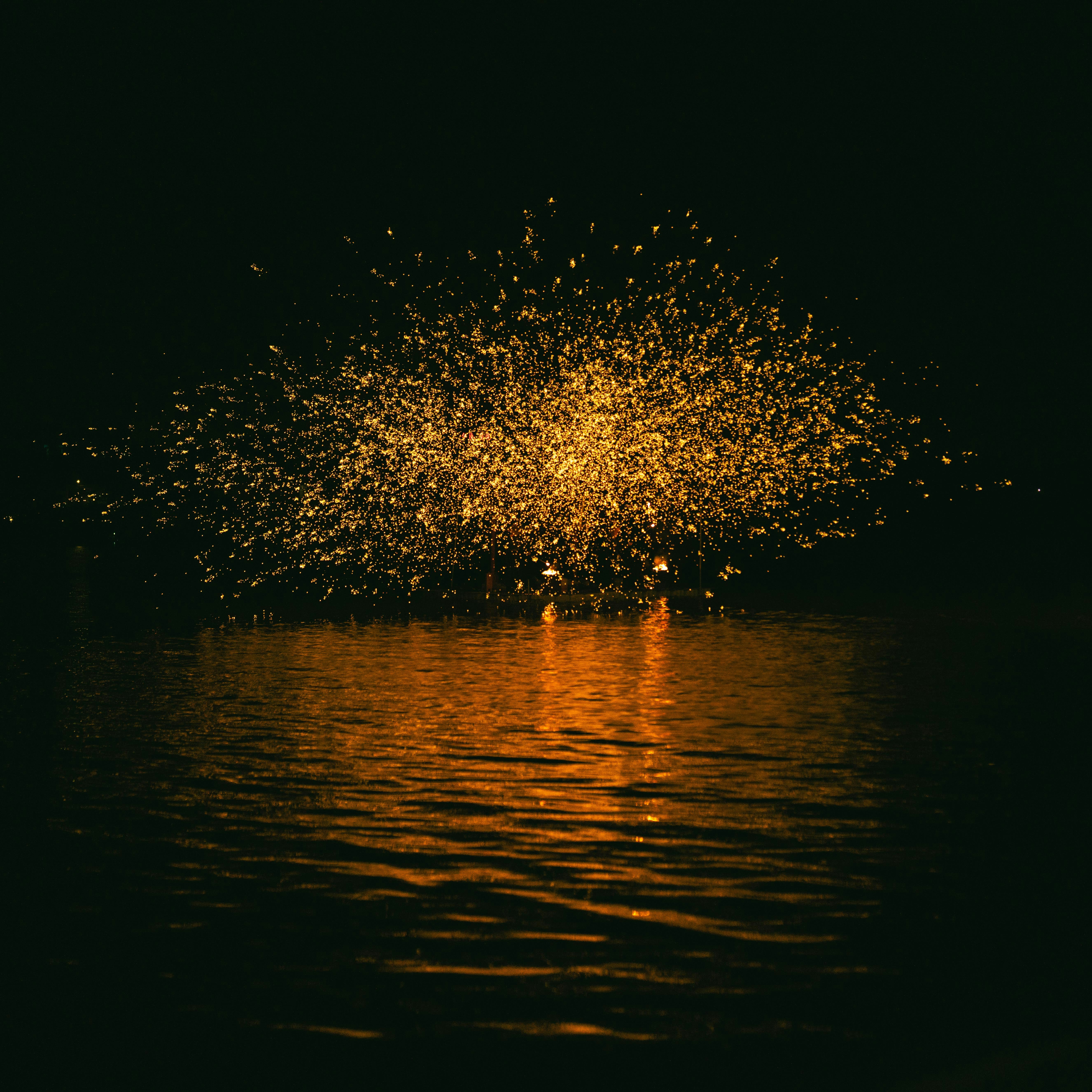 Splash of gold over midnight tide