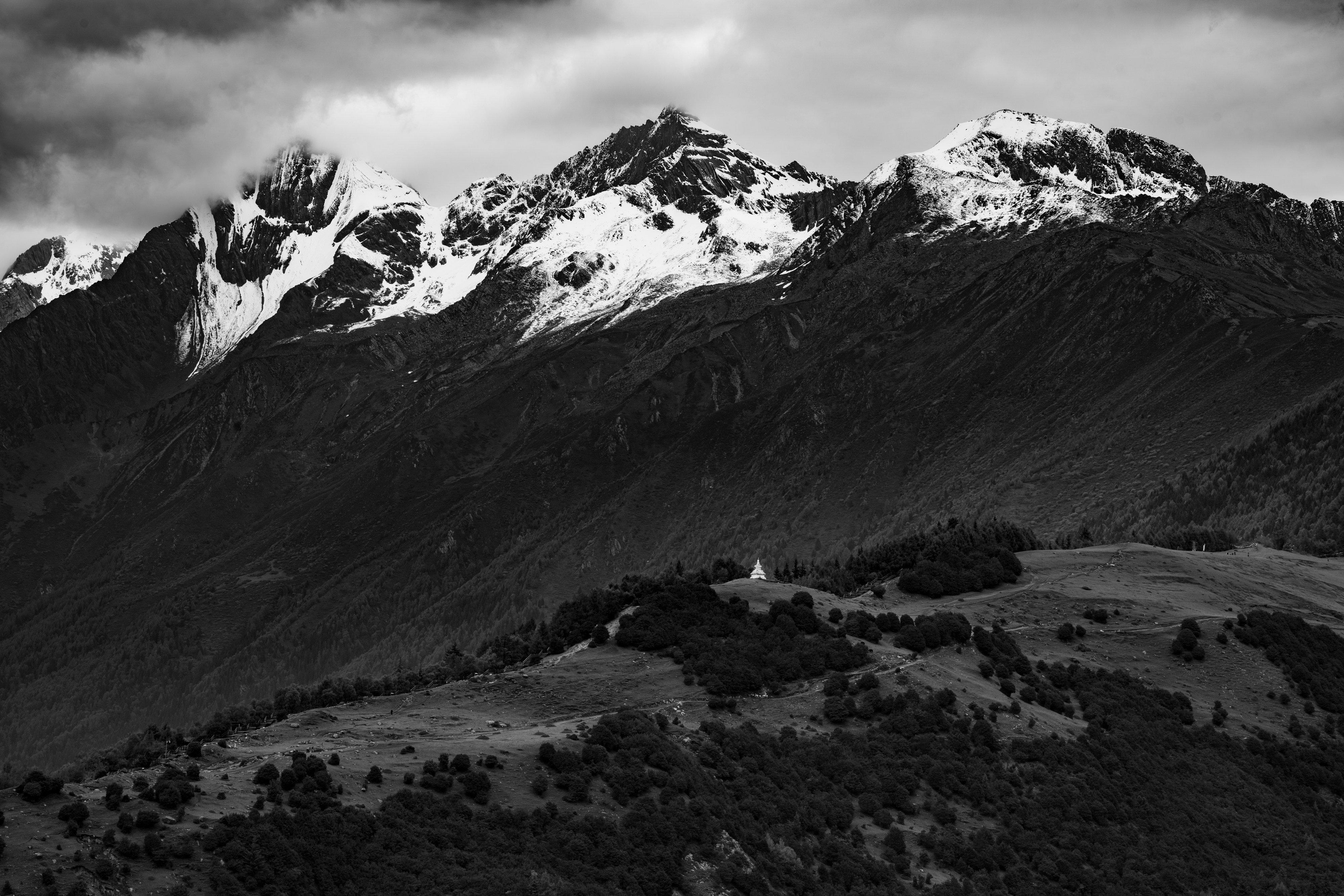 Snow-Crowned Ridges: A Lone House amid Alpine Silence