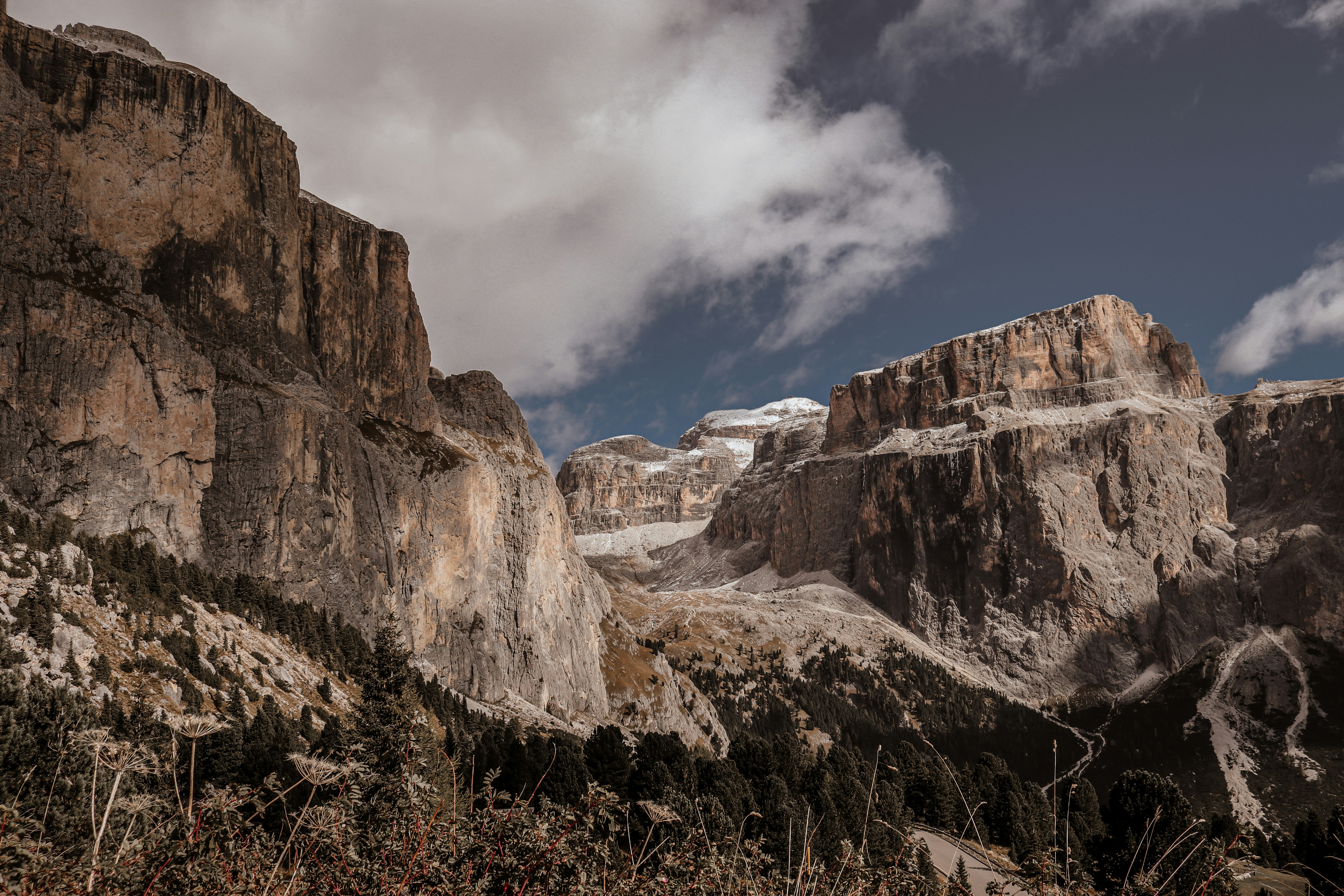 Snow-kissed cliffs under a break in the clouds