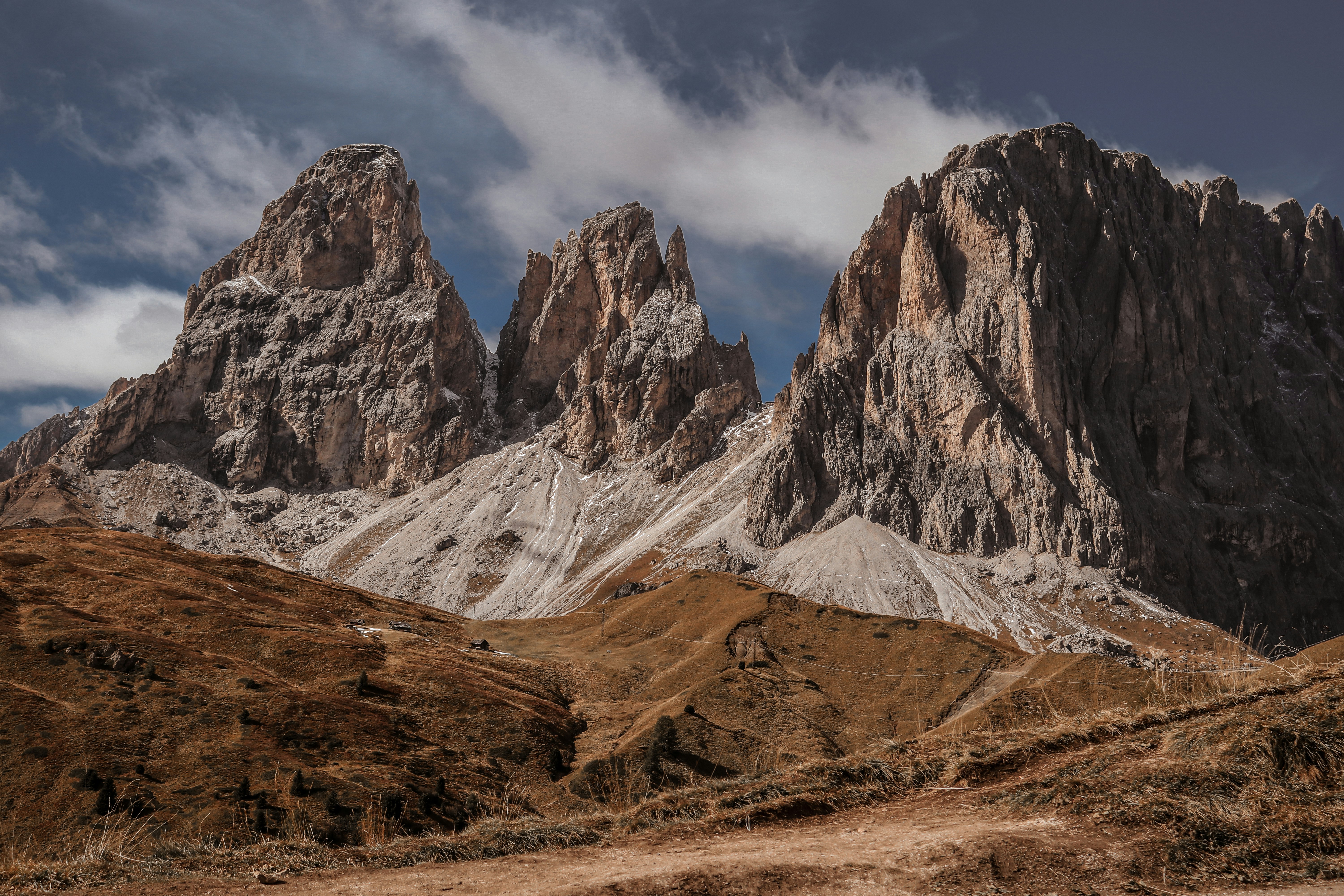 Cliff-faced Giants: A Rugged Pass Between Snow-kissed Peaks