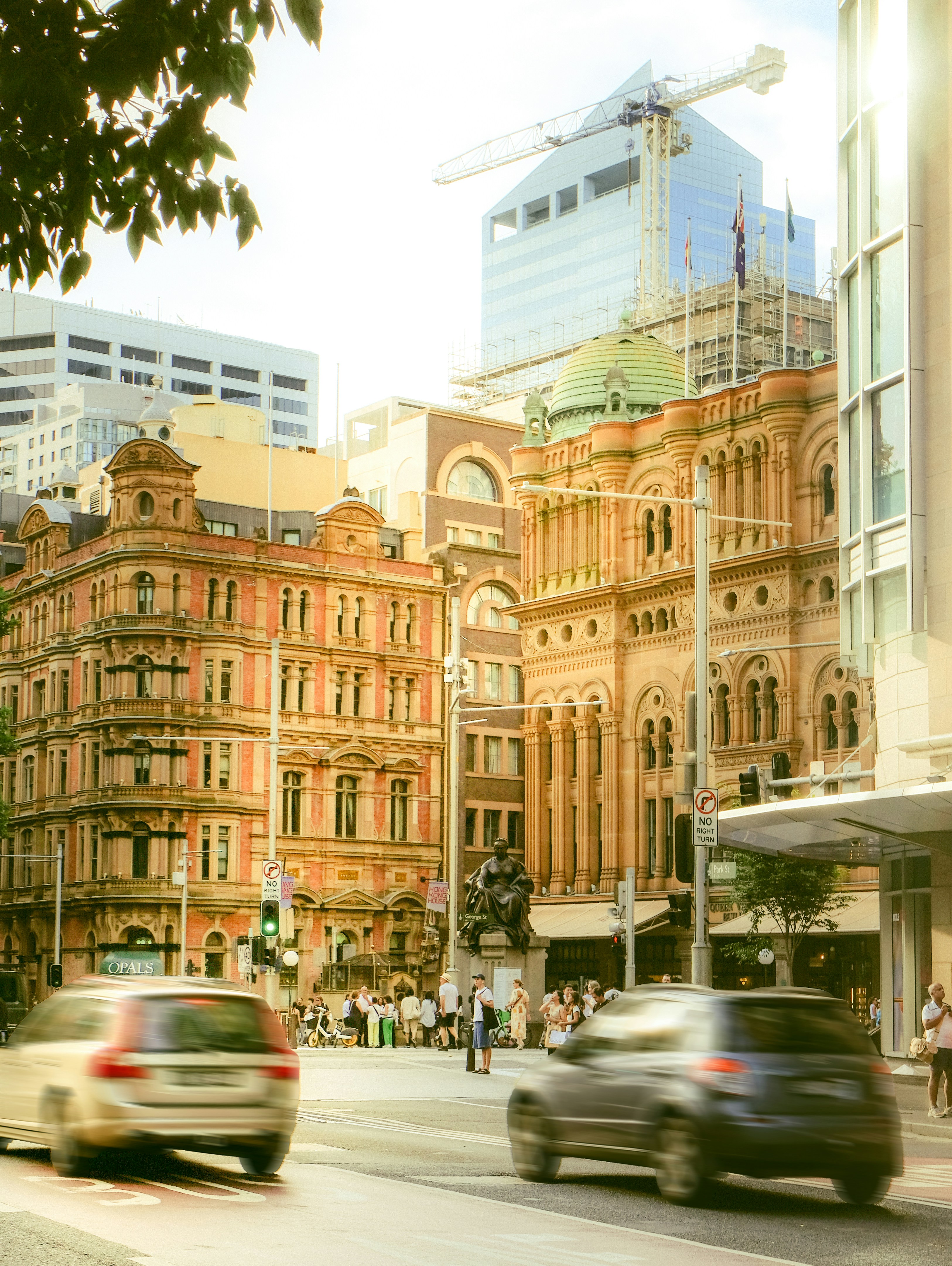 City Façade in Motion: Historic Corner Amid Modern Skyscrapers