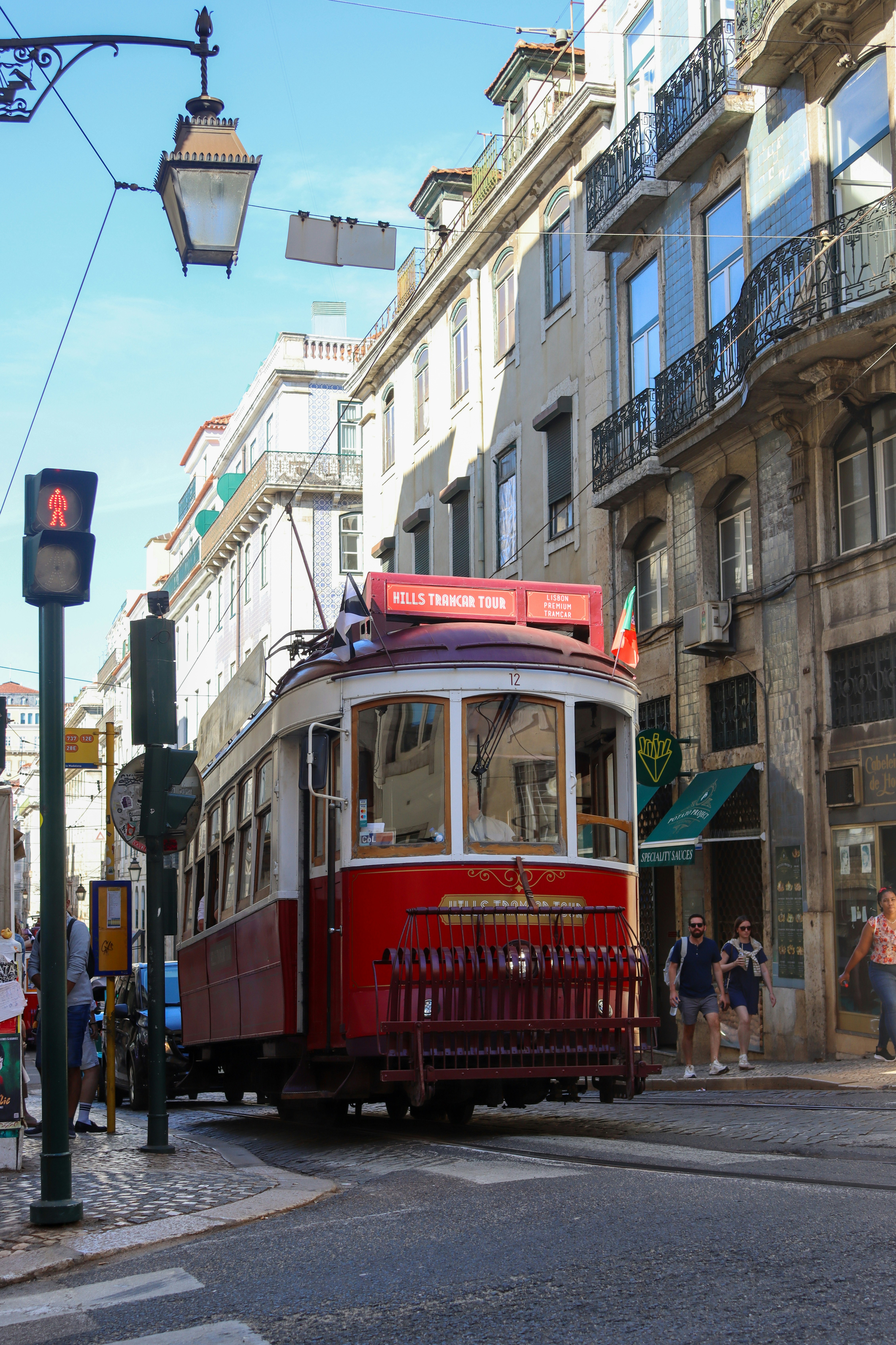 Heritage Tram on a Sunlit Lisbon Street