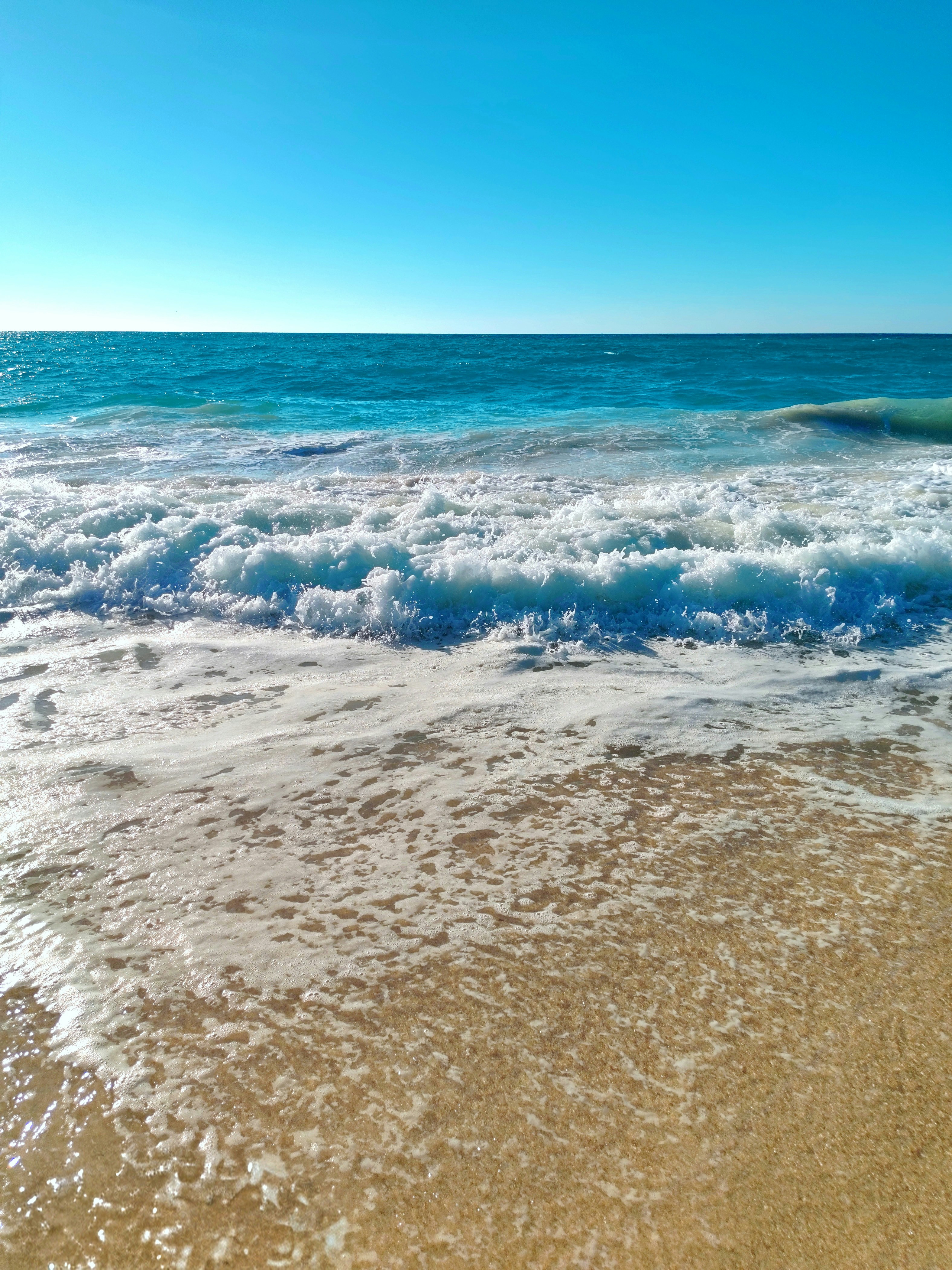 Azure Horizon and Cresting Tide