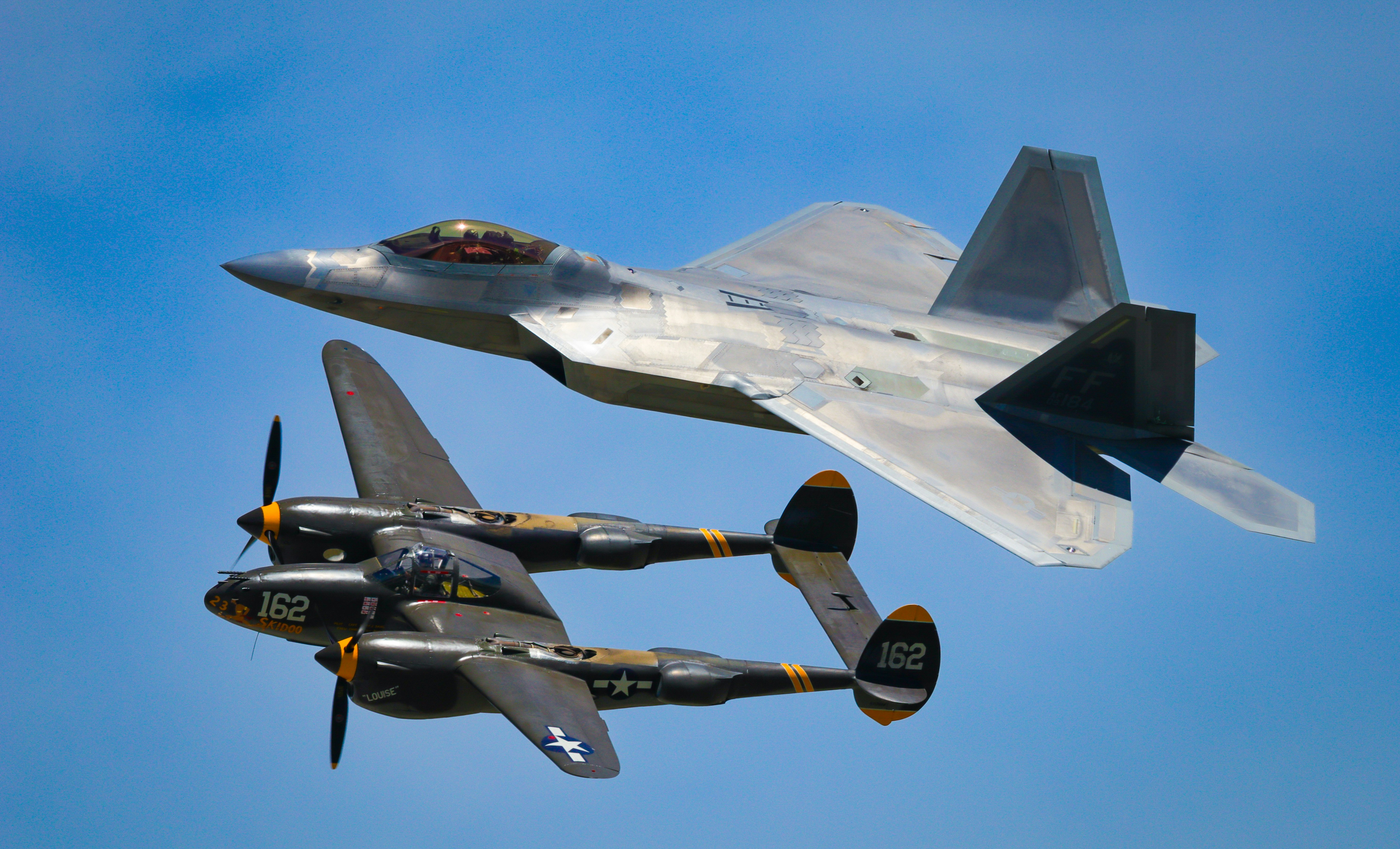 Twin Fighters in Formation: A P-38/P-51 Classic Pass