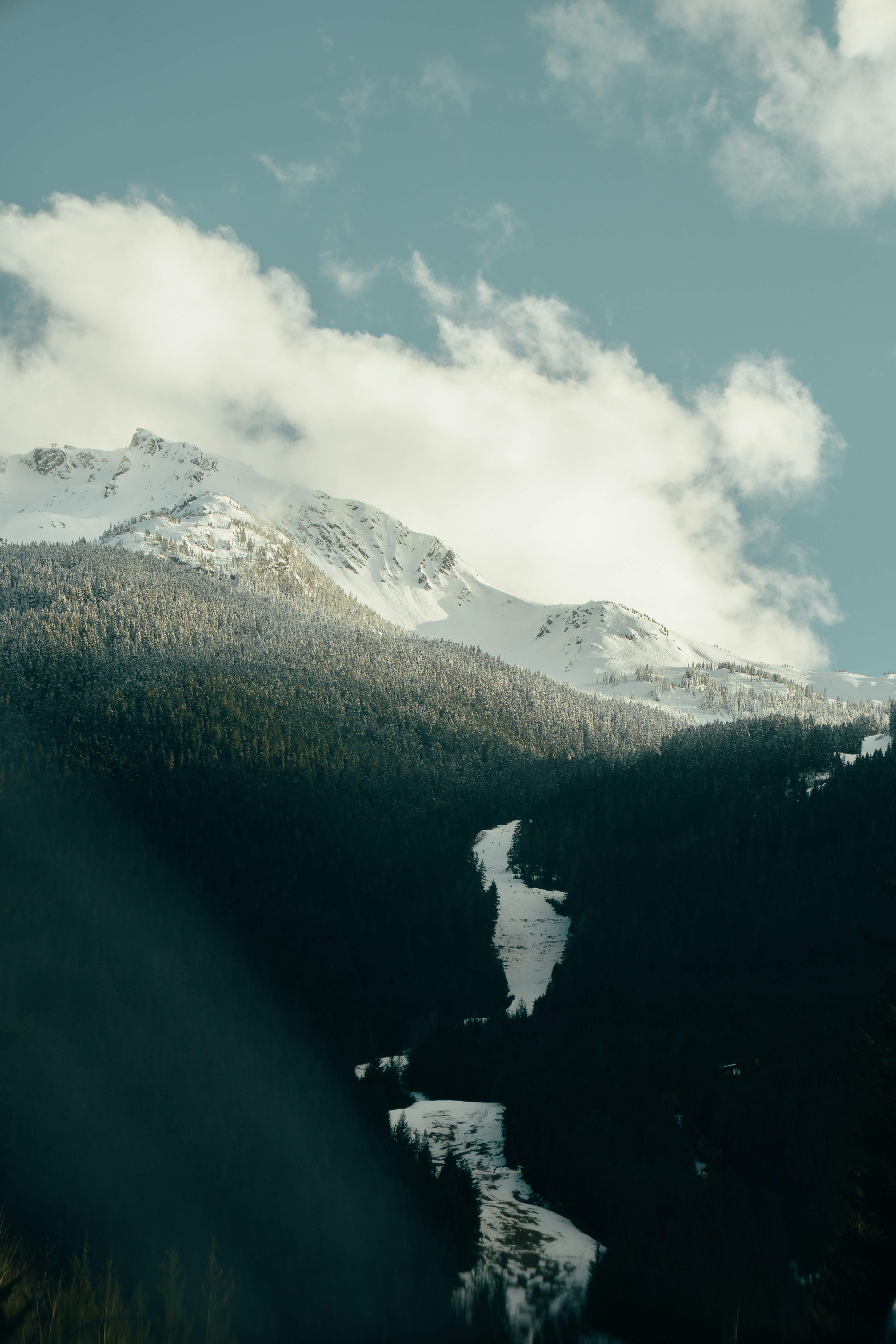 Snowbound Crest: A Mountain Ridge Shrouded in Light